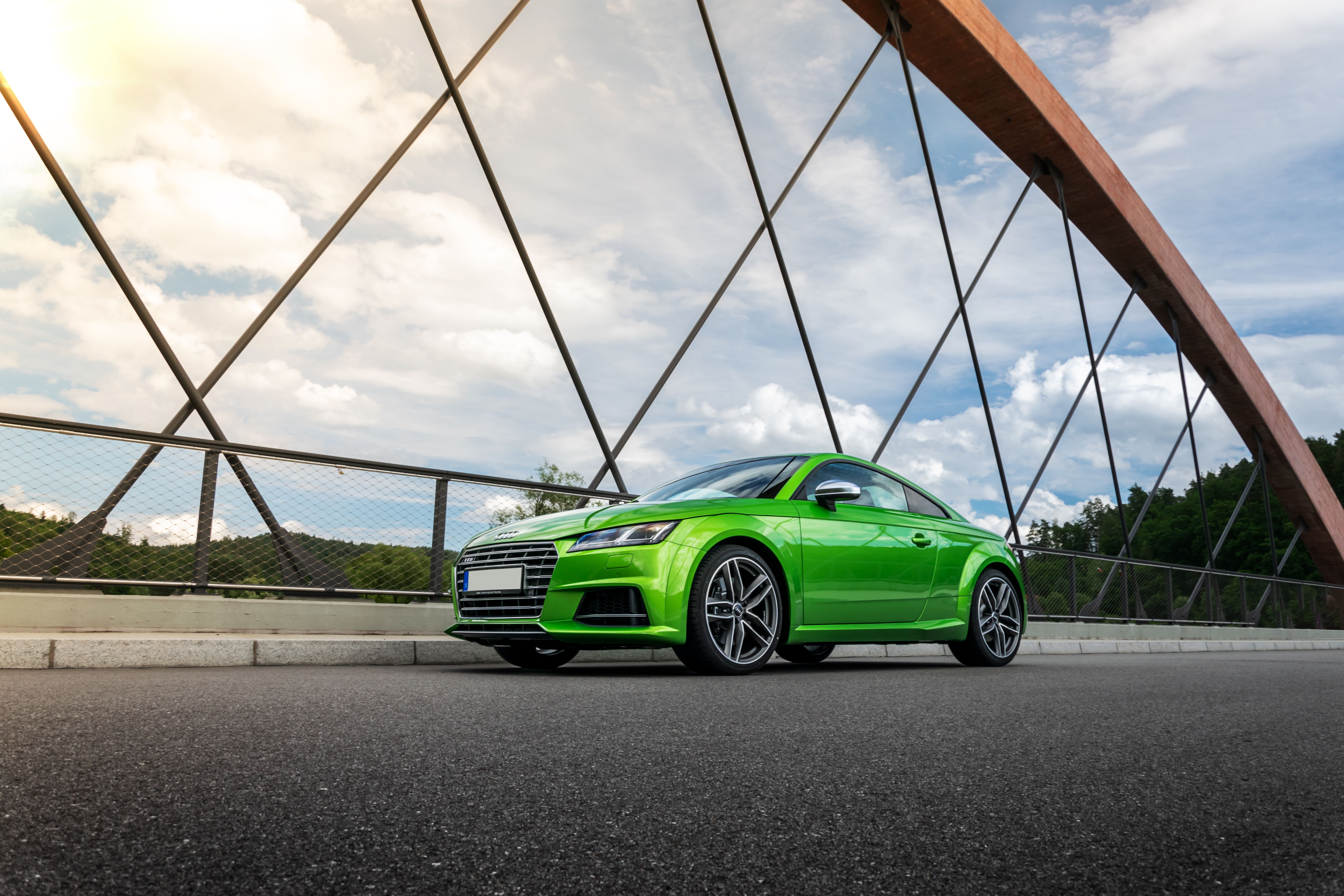 A Low Angle Shot of a Luxury Car Parked on the Road · Free Stock Photo