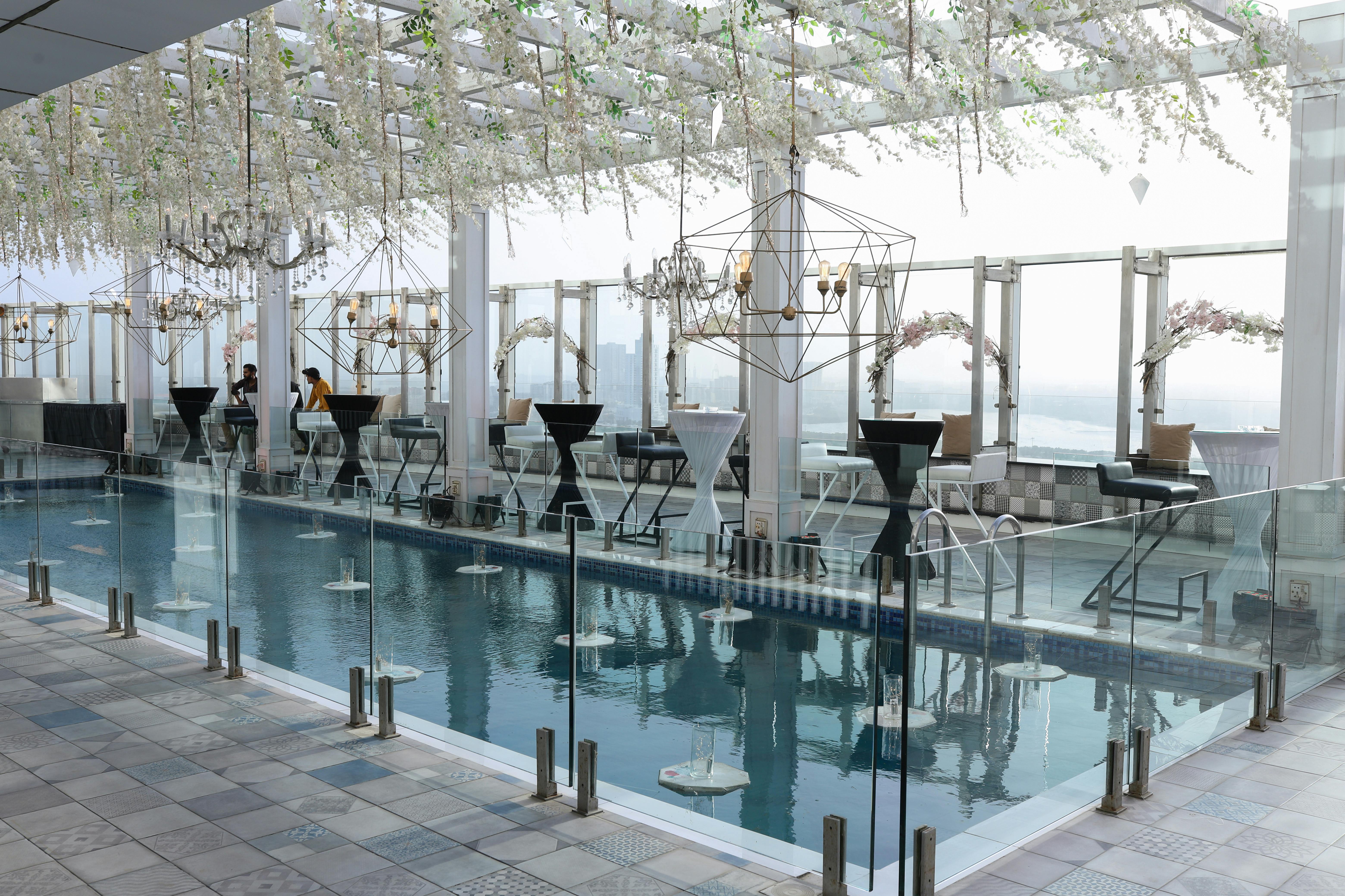 Indoor Swimming Pool with Glass Railing · Free Stock Photo