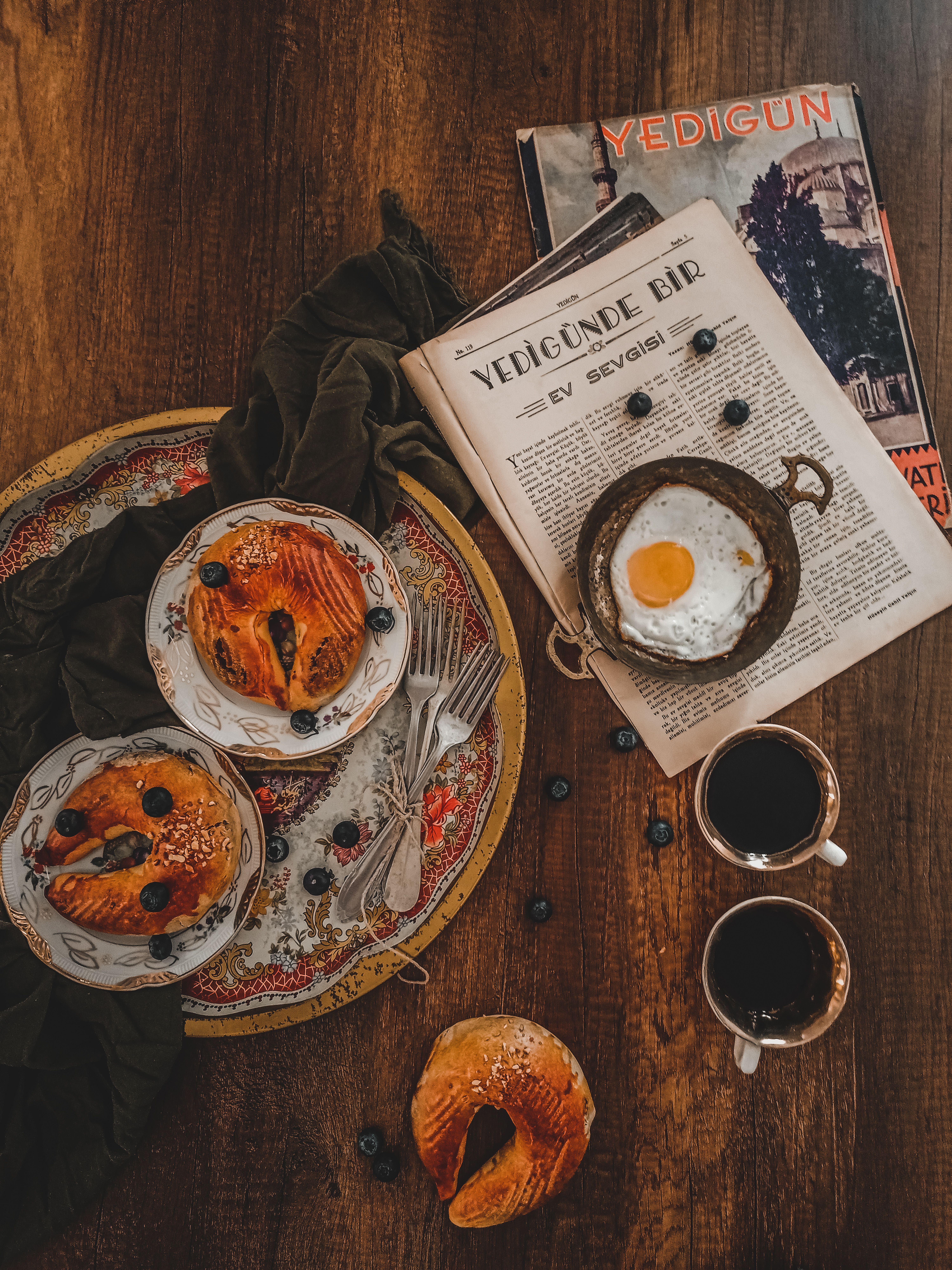 Plates with Breakfast, Cups of Coffee and Magazines on a Table · Free ...