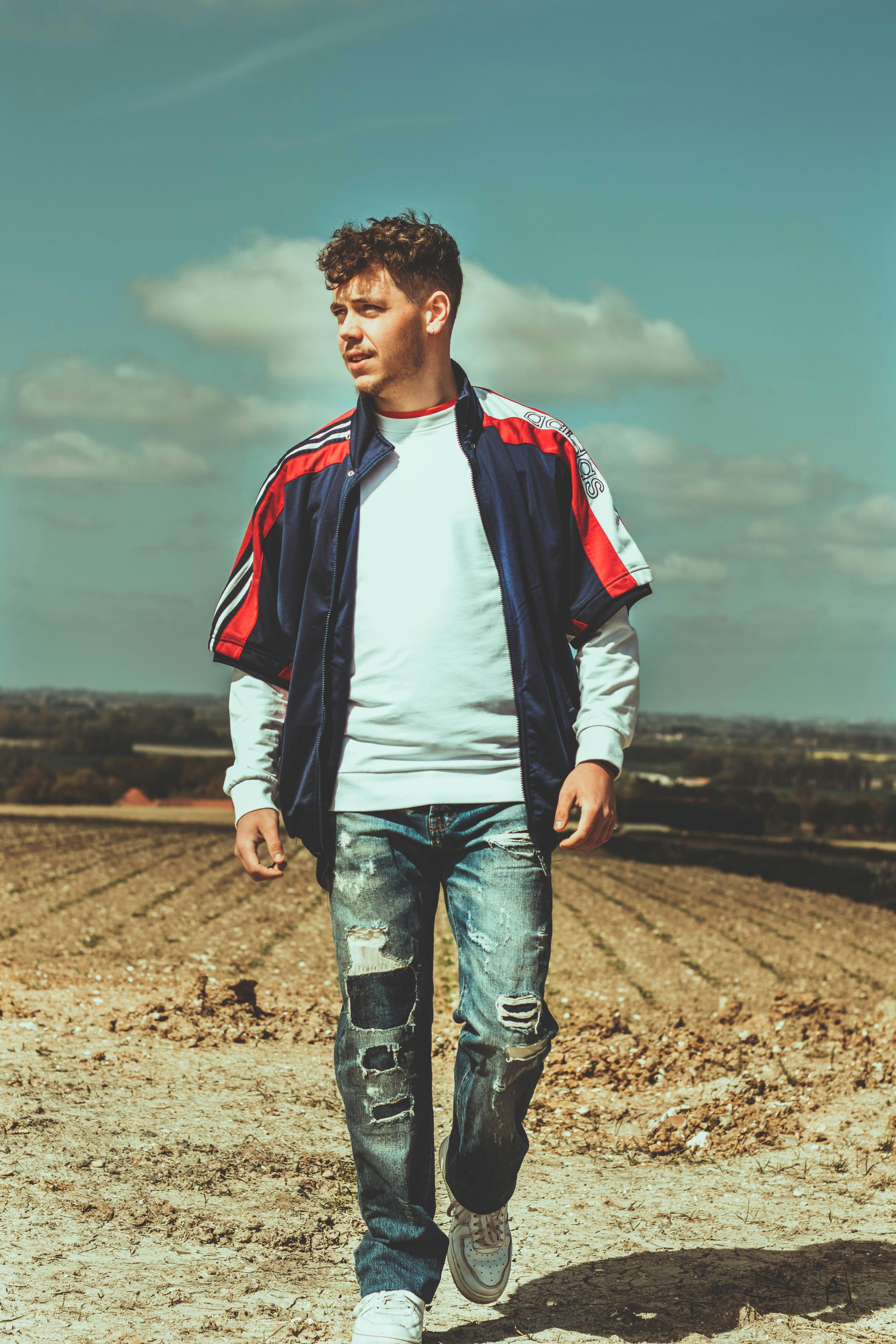 Man Sitting on Bench · Free Stock Photo