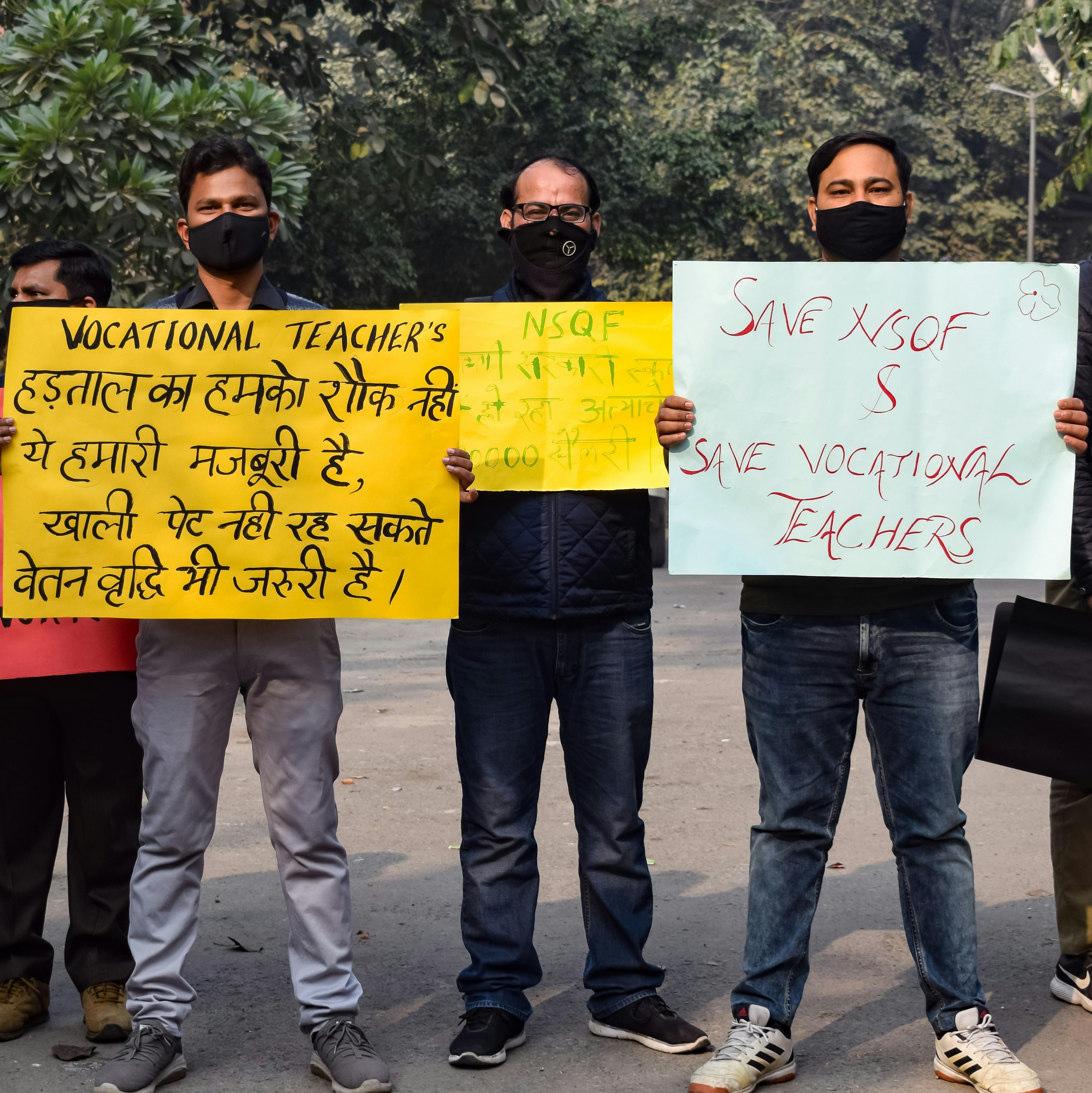 A Crowd of People Holding Posters in a Rally · Free Stock Photo