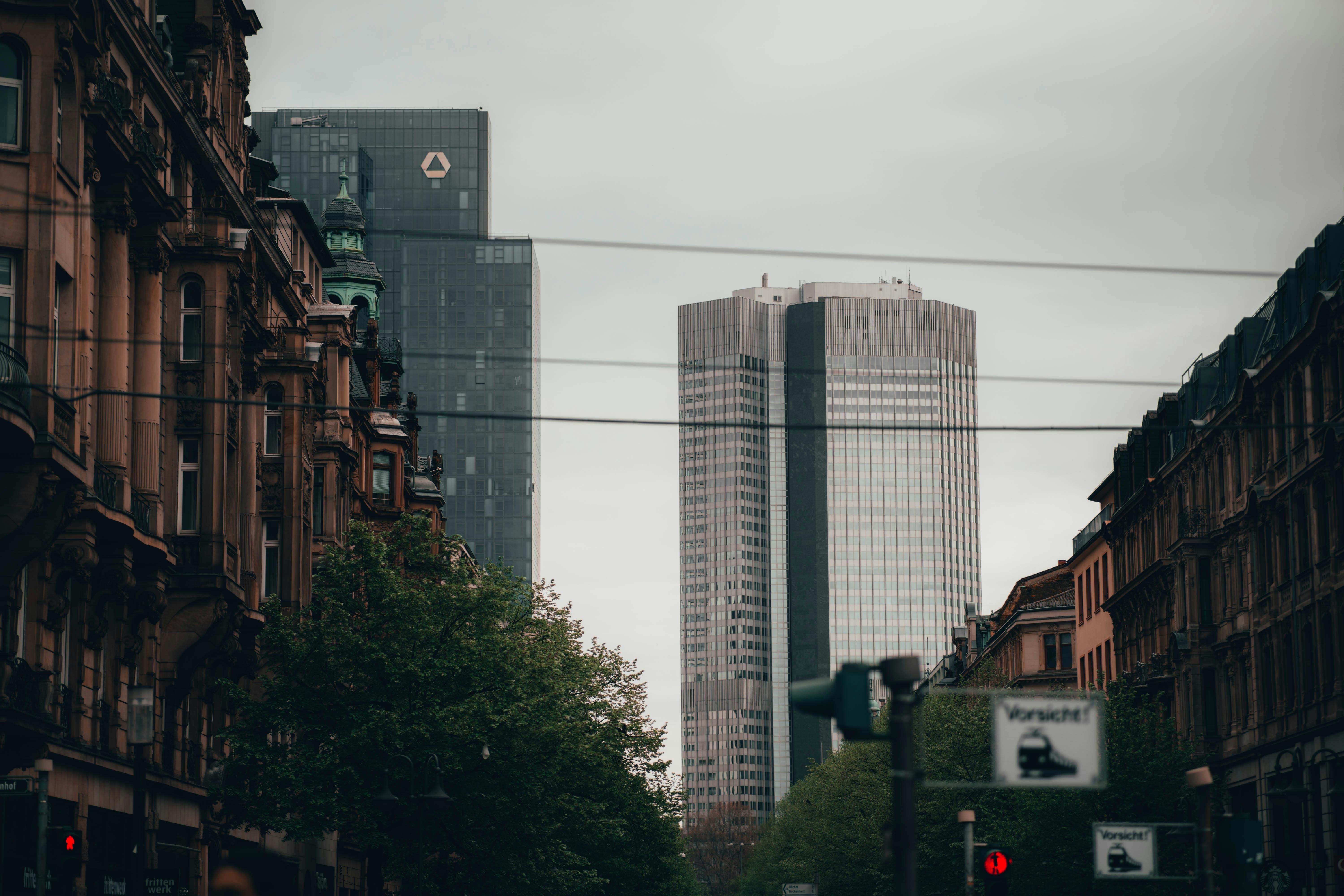 Building of Skyscraper Near Green Trees · Free Stock Photo