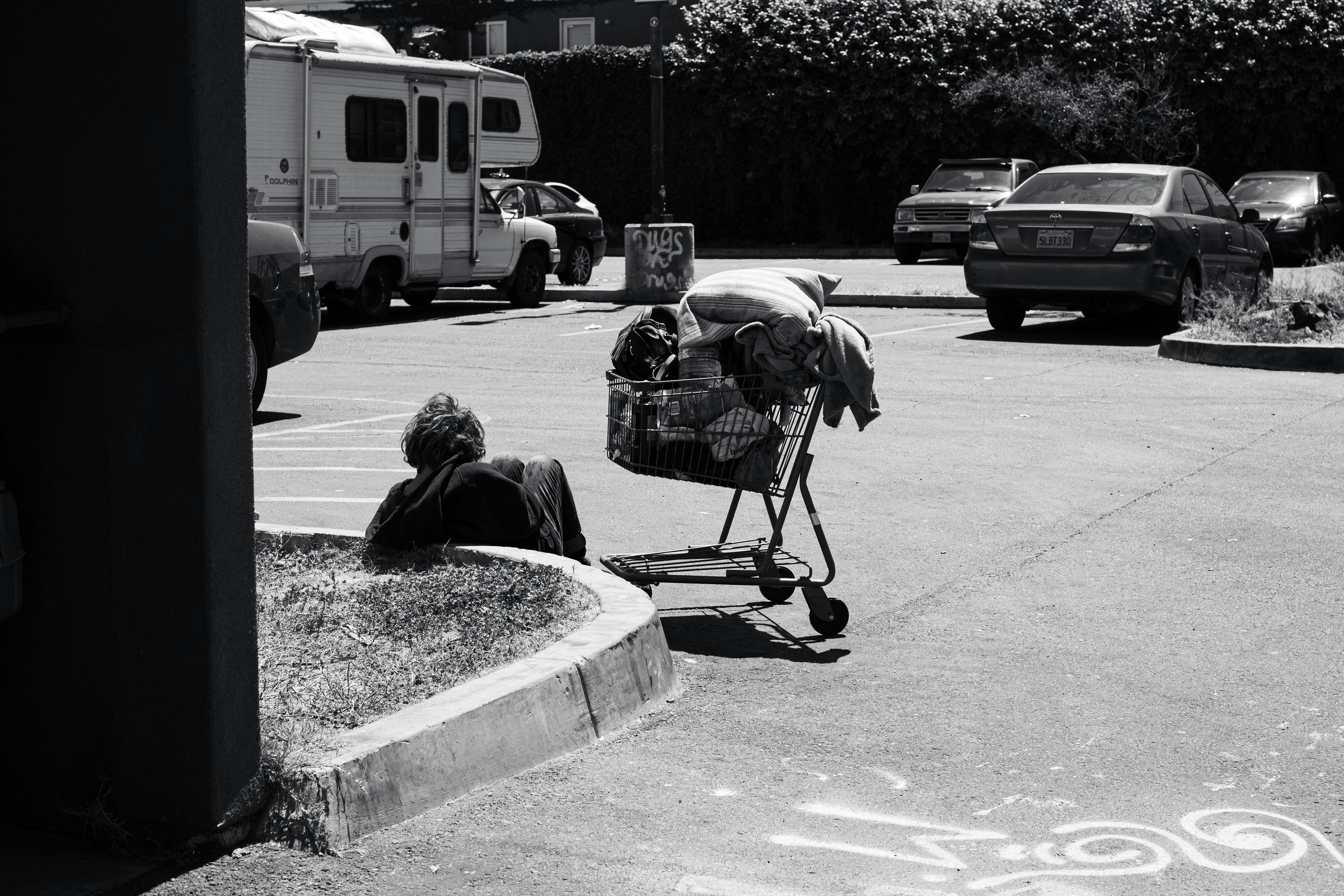 A Homeless Man Pushing Shopping Cart · Free Stock Photo