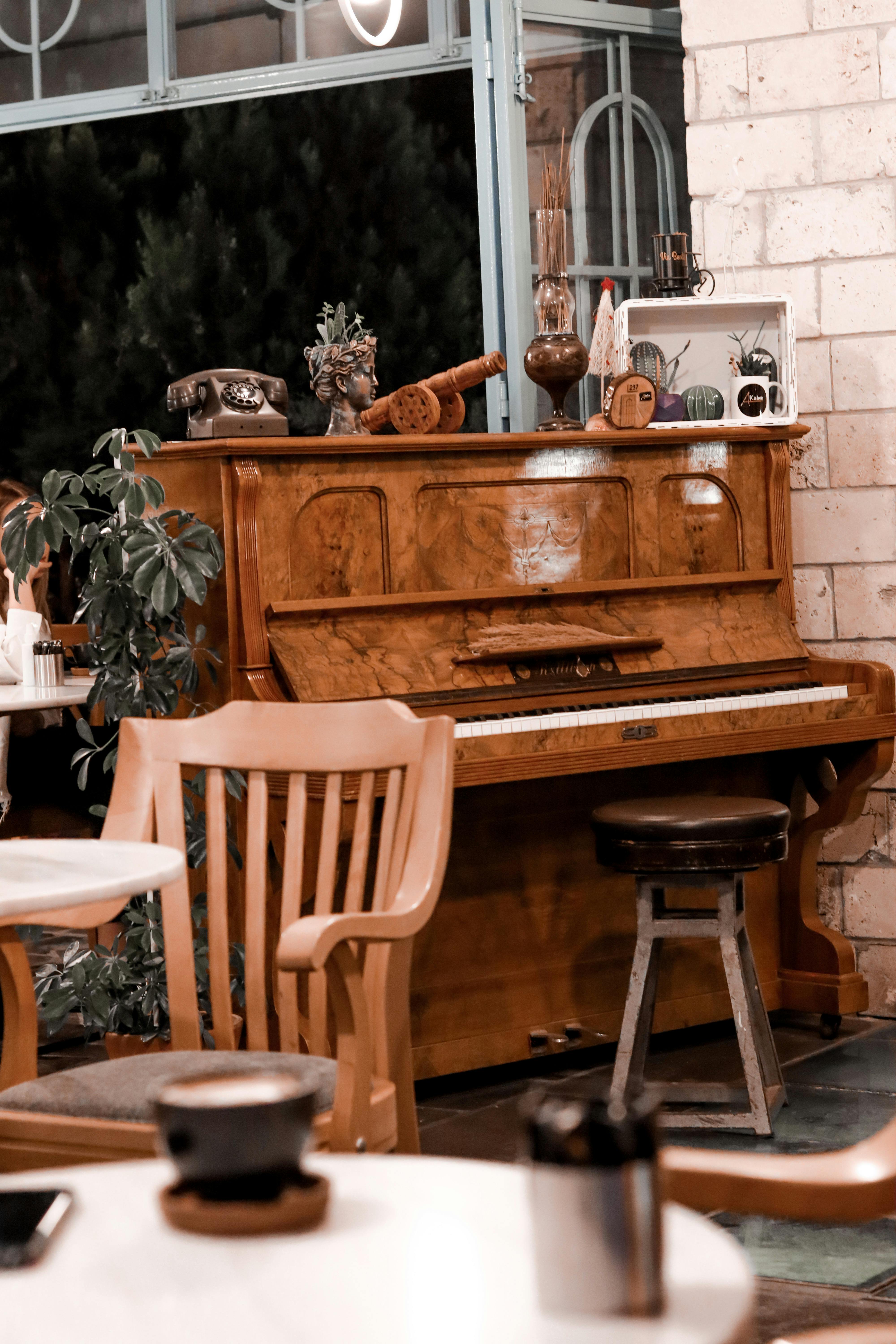 Brown Wooden Upright Piano Beside Brown Wooden Chair · Free Stock Photo