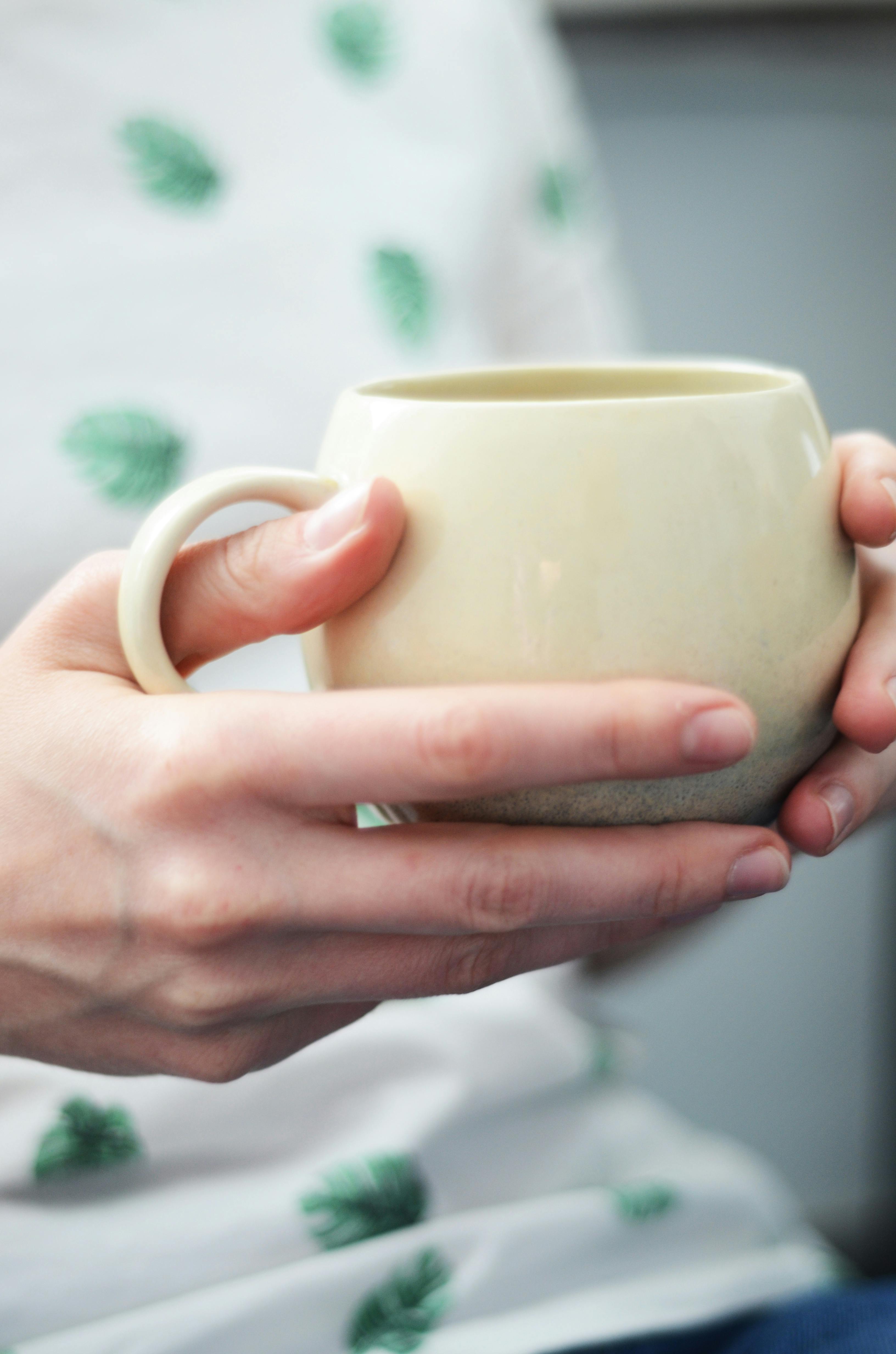 Person Holding White Ceramic Mug · Free Stock Photo