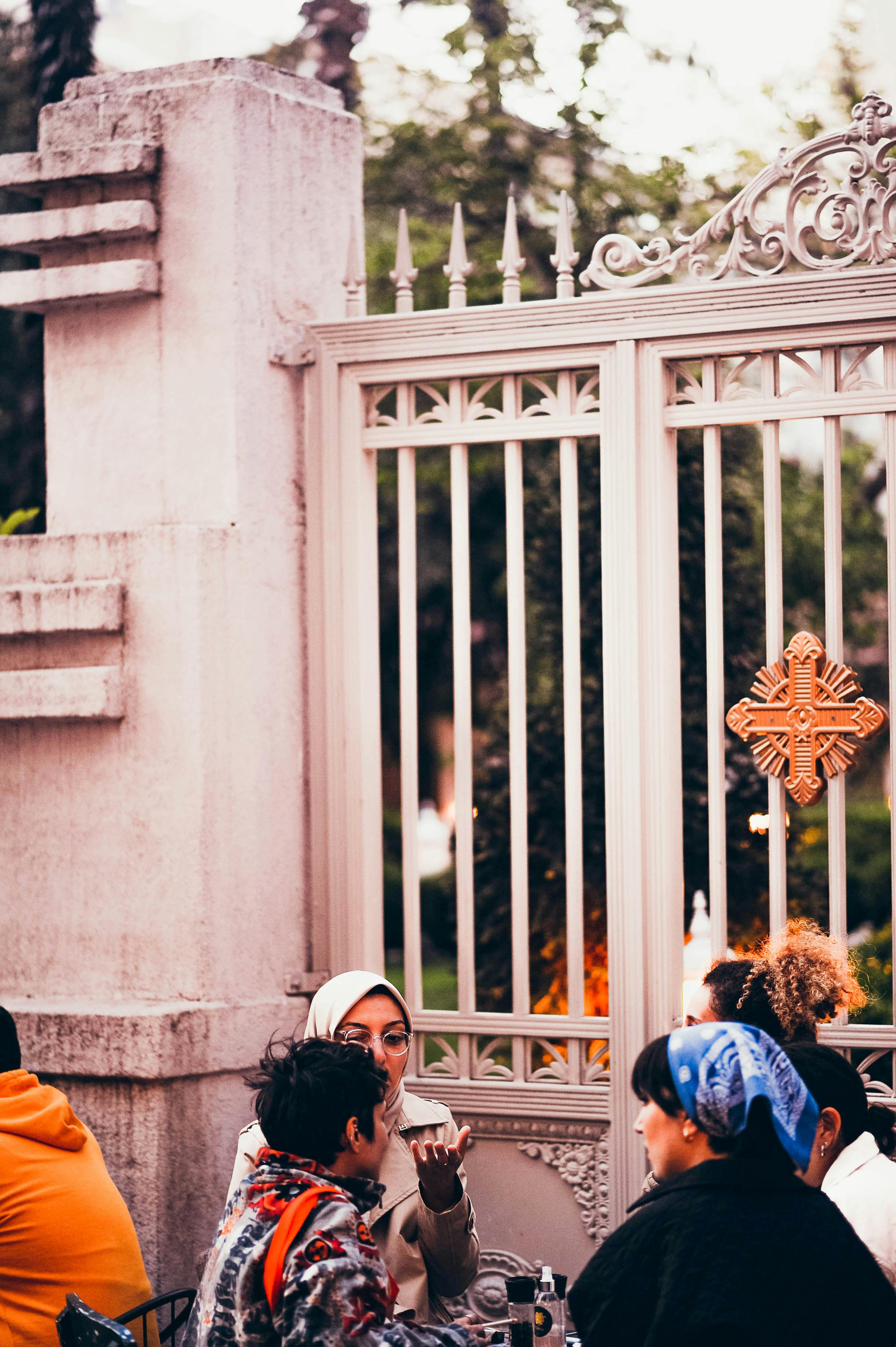 People Standing in Front of a Gate · Free Stock Photo