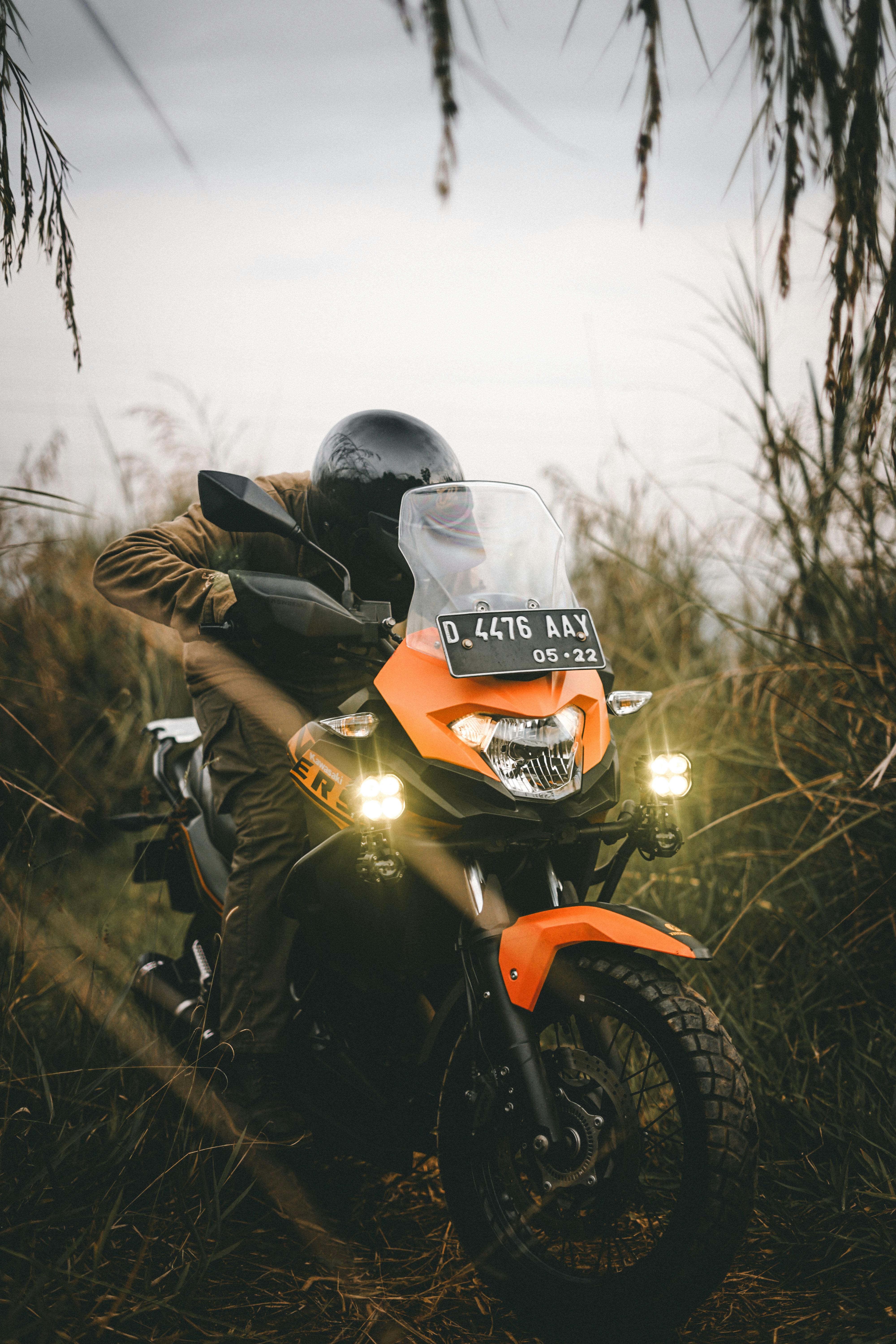 Person Driving Motorcycle in Rural Area · Free Stock Photo