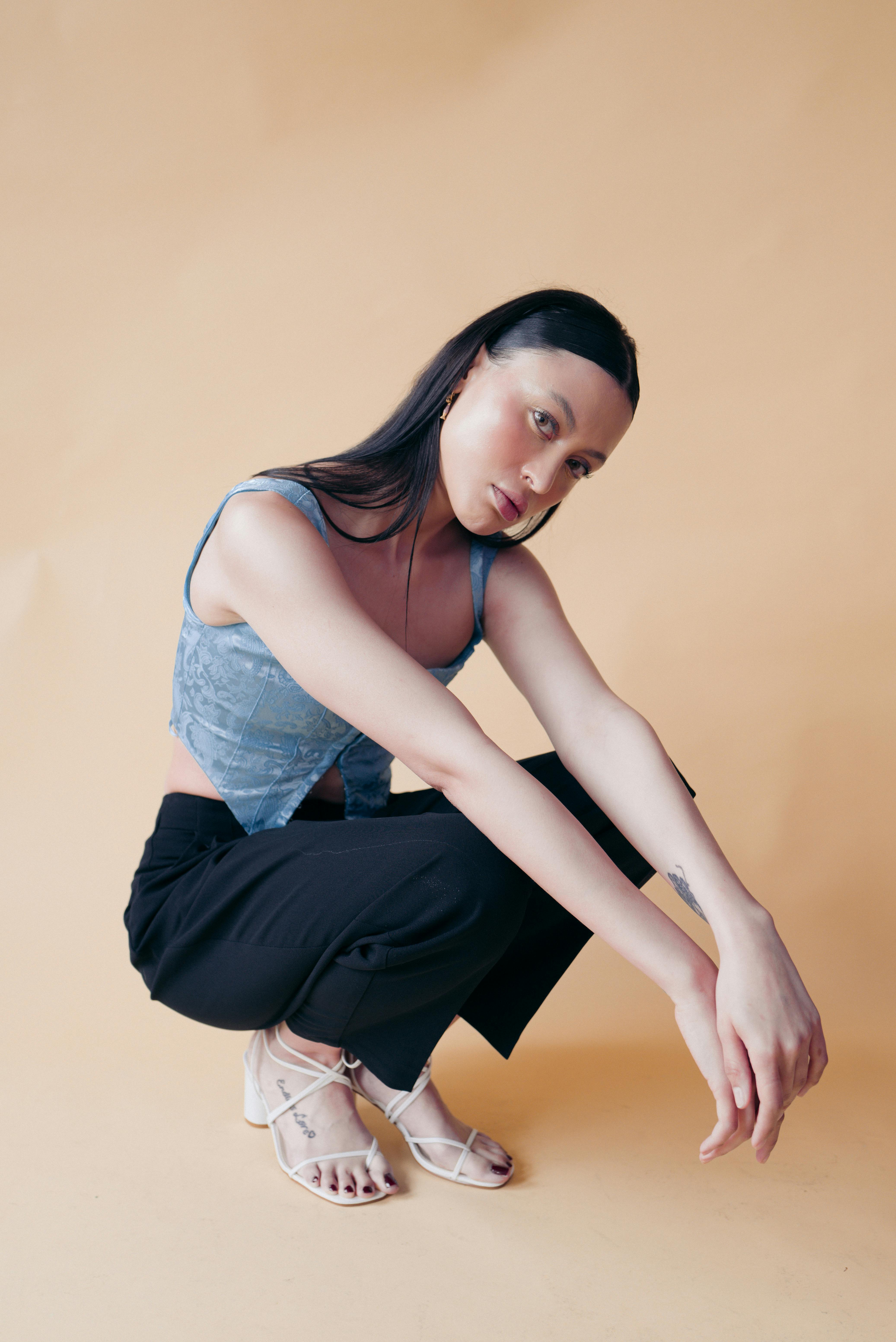 Photo of a Crouching Woman · Free Stock Photo