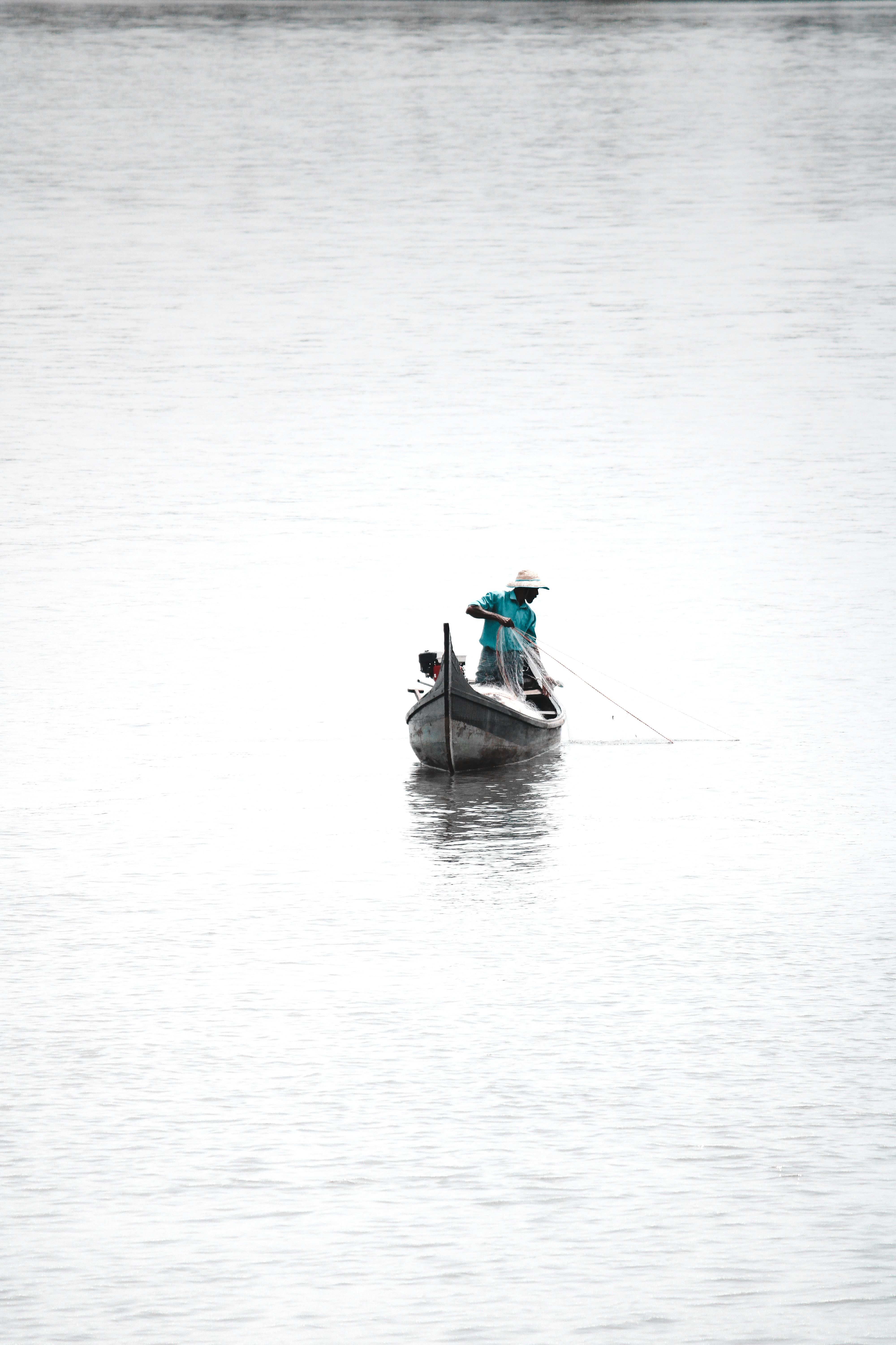 A Man Holding a Fishing Net · Free Stock Photo