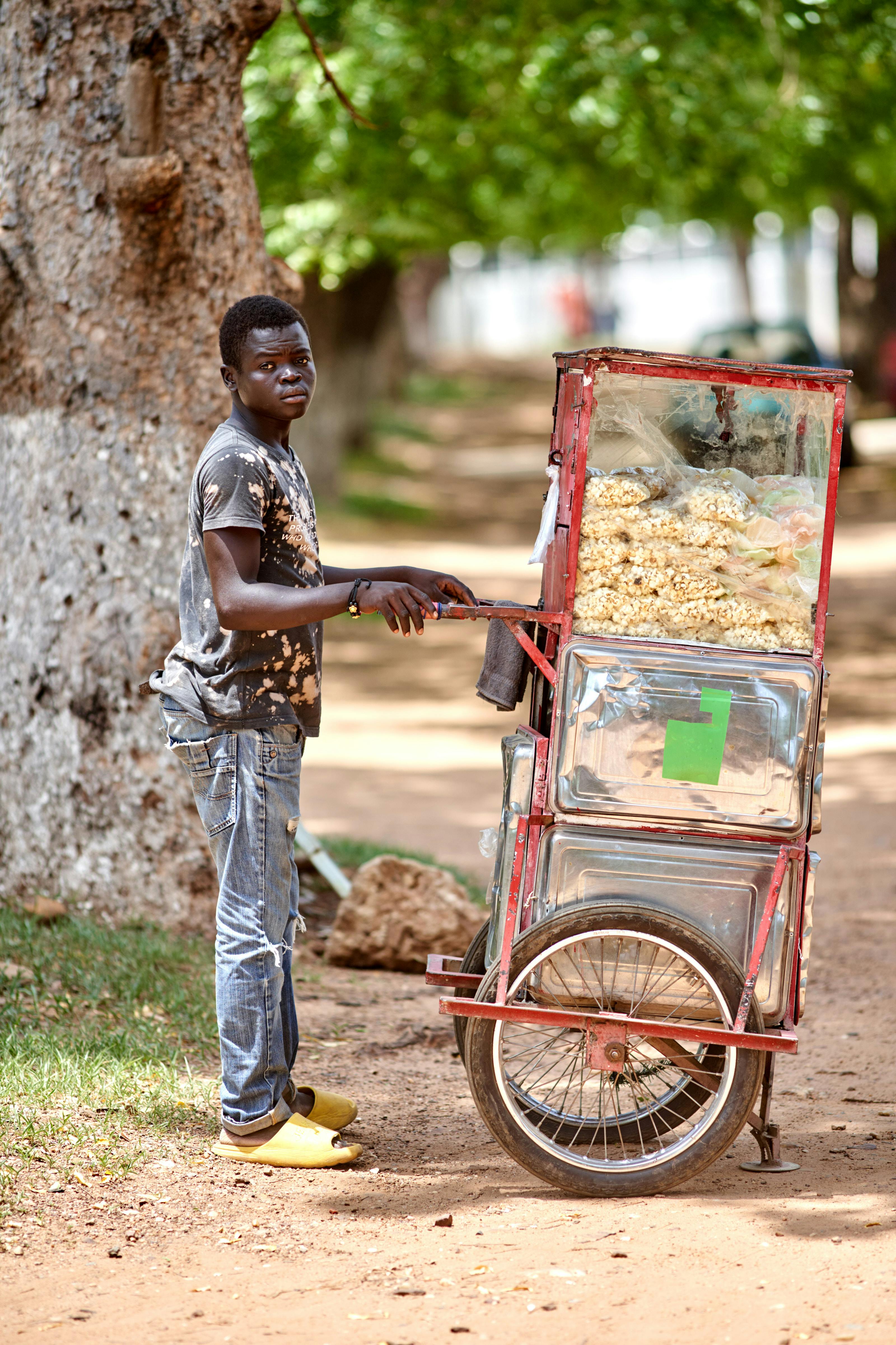 A Street Vendor Selling Popcorn · Free Stock Photo
