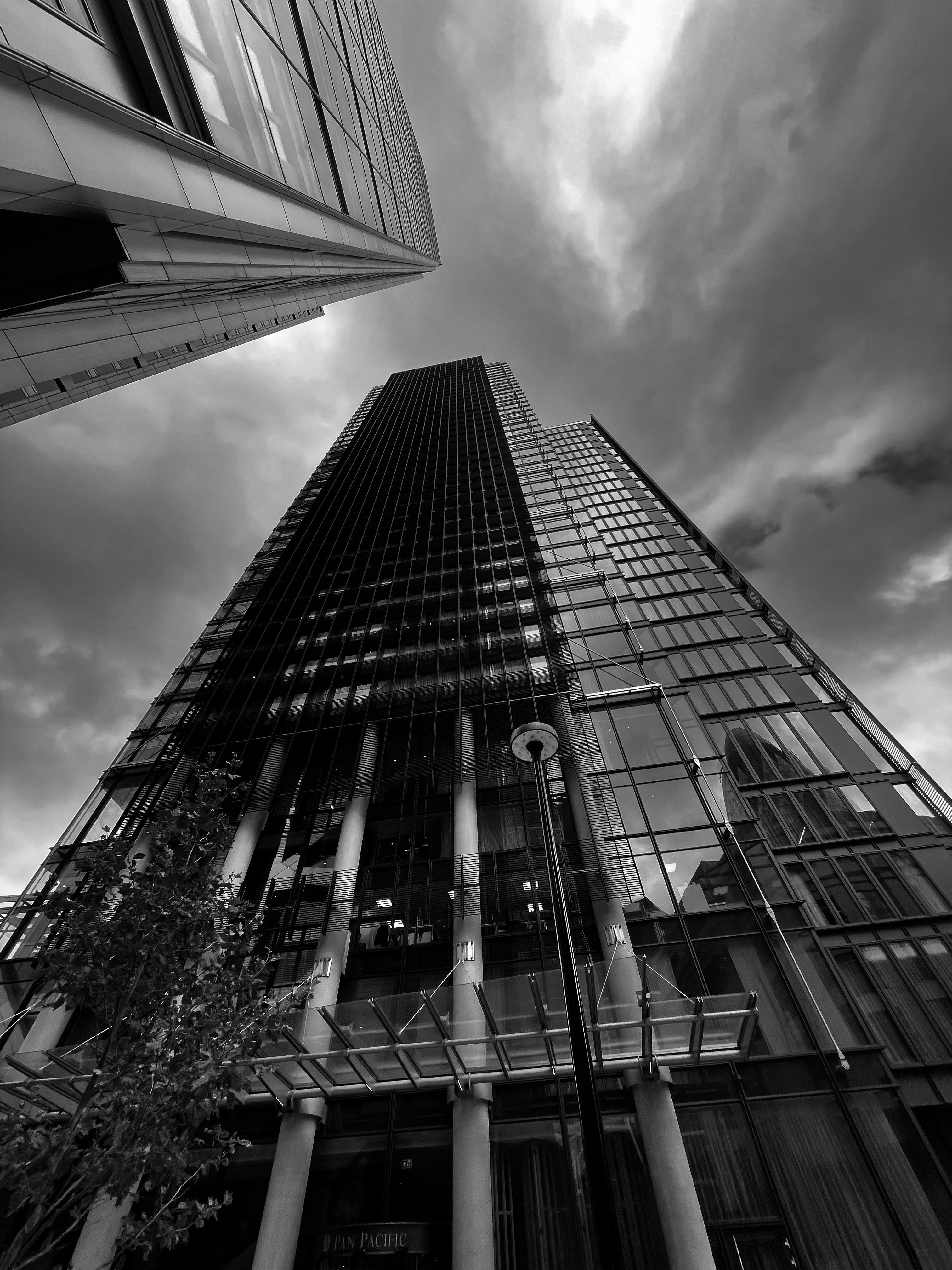 Grayscale Photography of Brick Building · Free Stock Photo