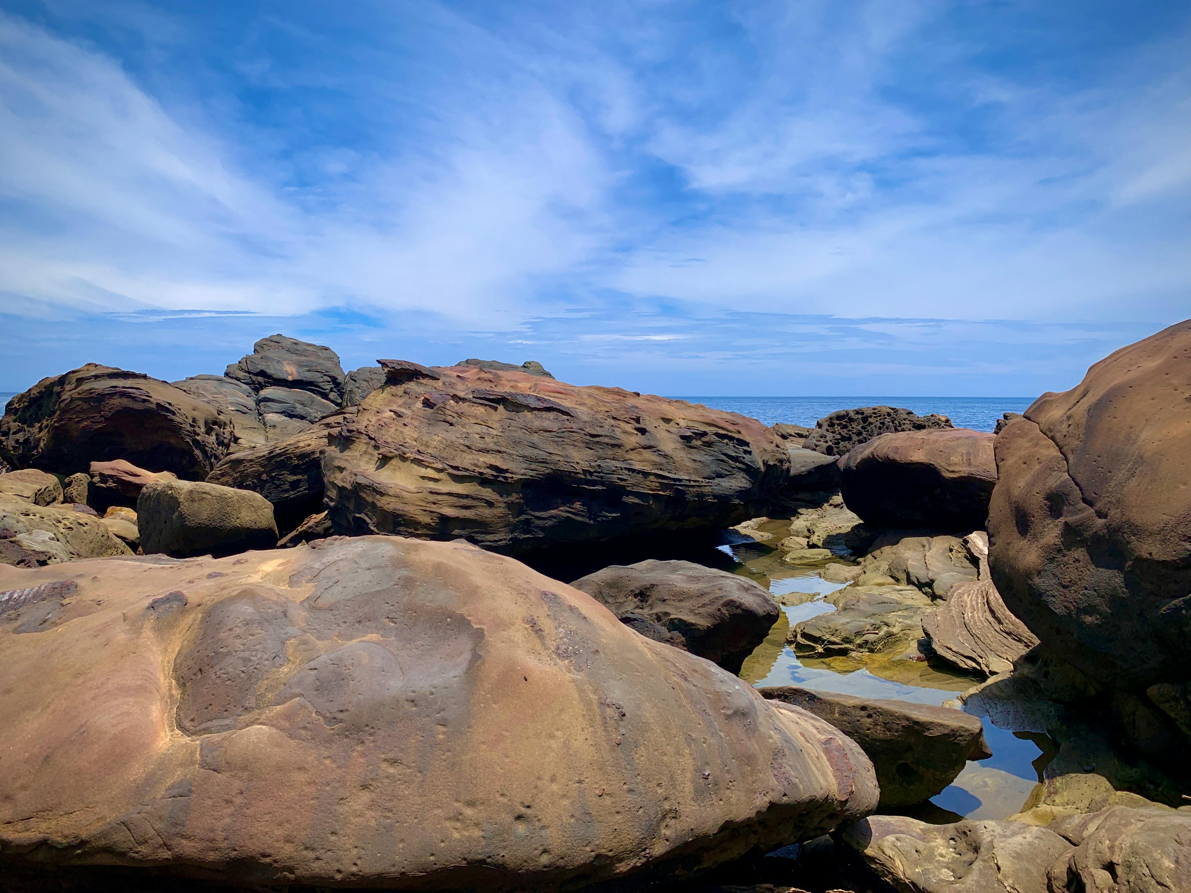 Brown Rocky Shore Under the Blue Sky · Free Stock Photo