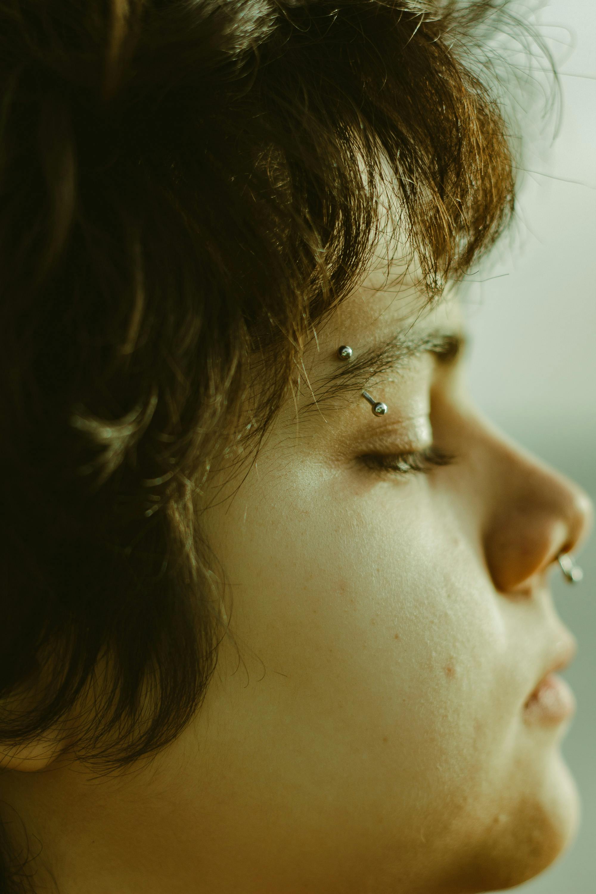 Headshot of a Person with Nose Piercing and Eyebrow Piercing · Free ...