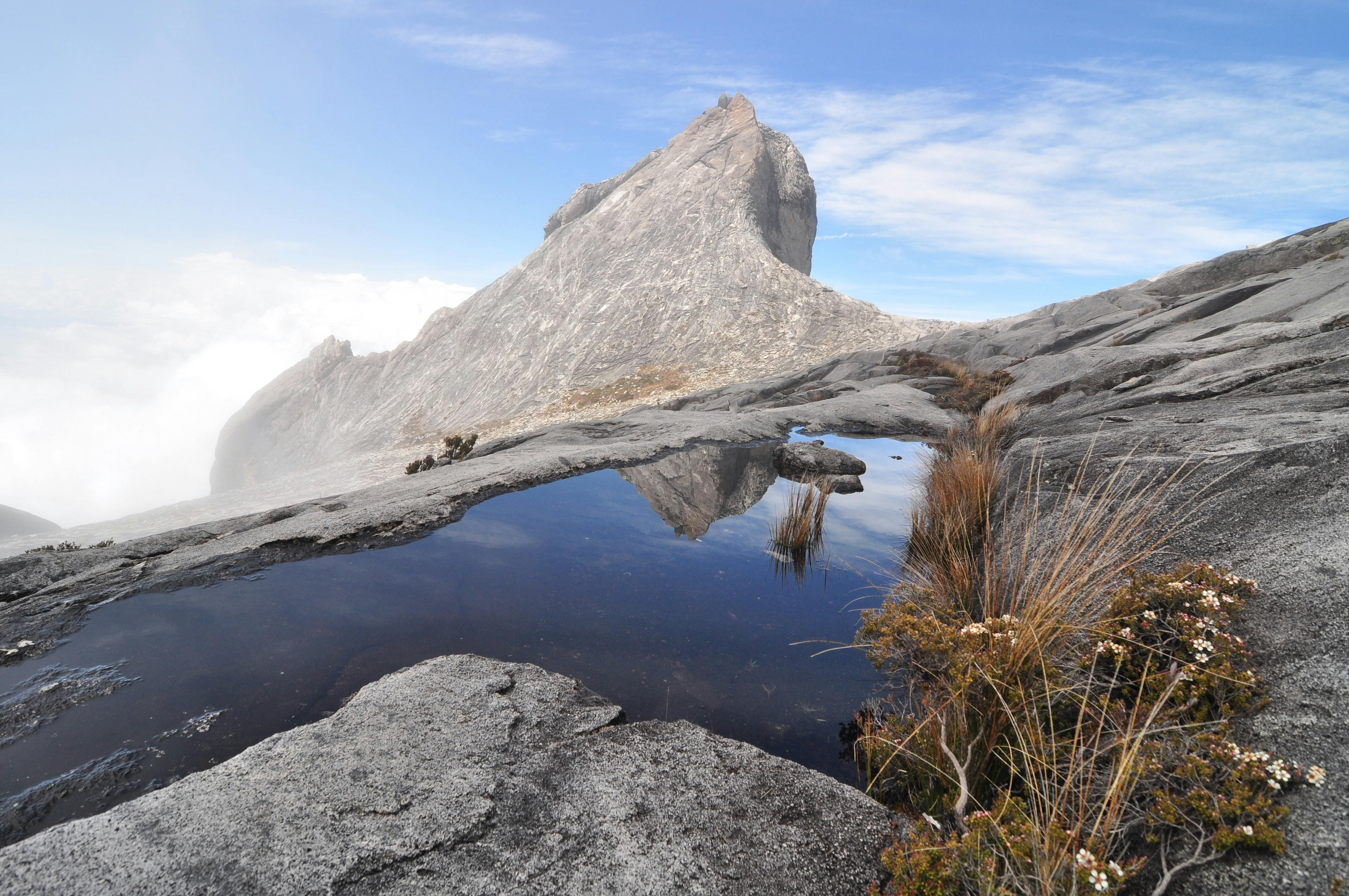 Puddle near Rock Formation · Free Stock Photo