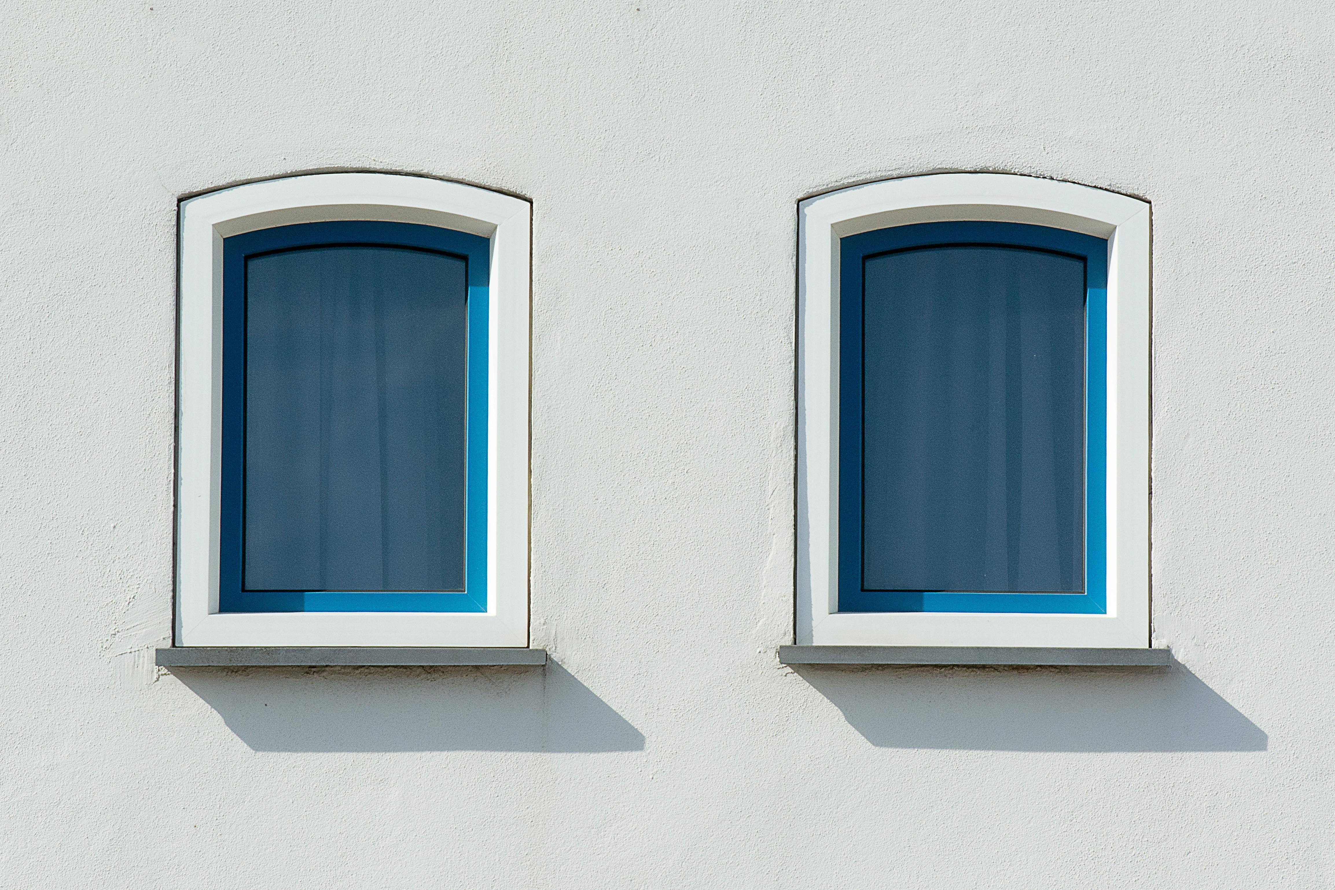 Blue Windows on House White Wall · Free Stock Photo