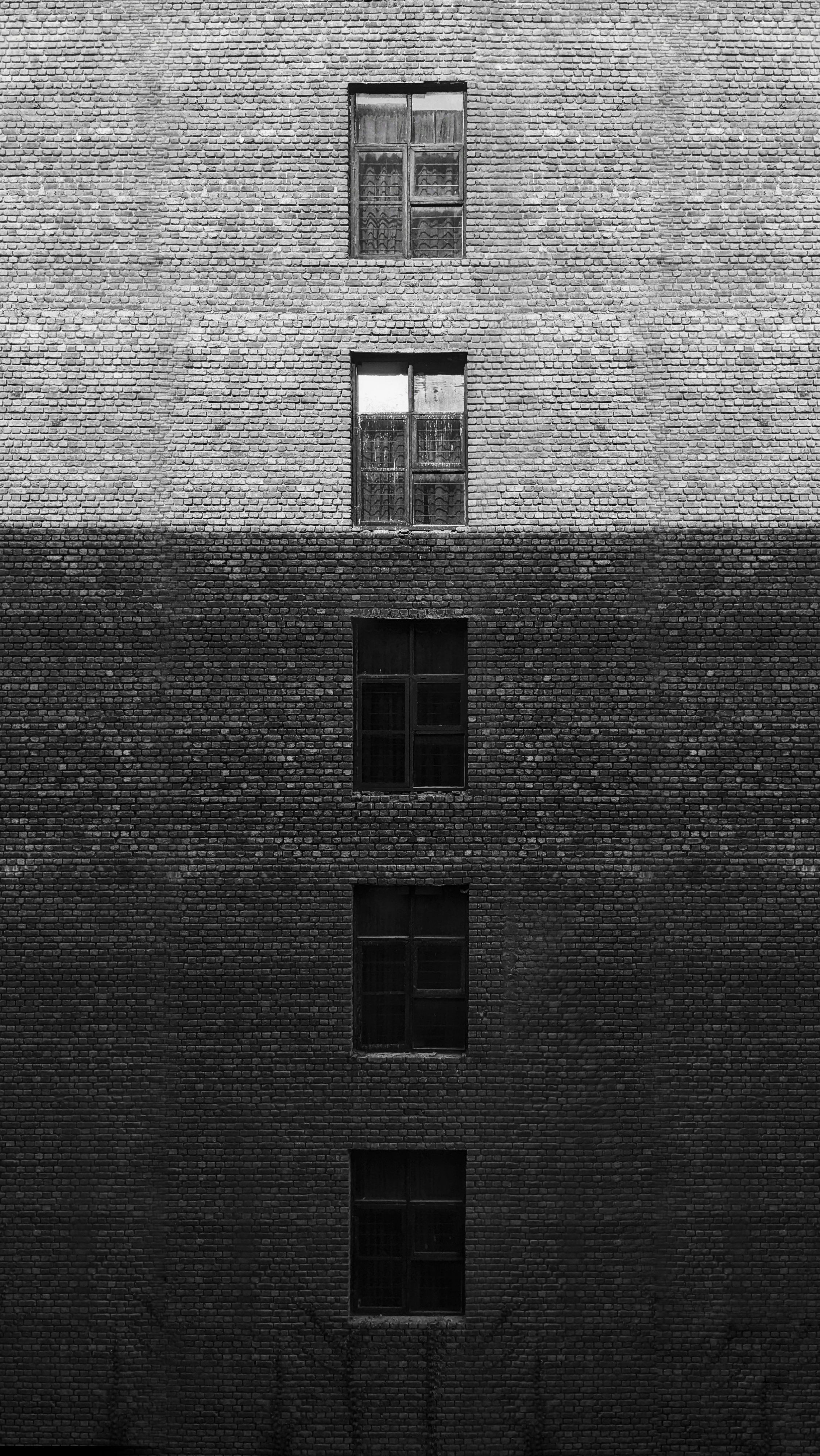 Grayscale Photo of a Brick Building · Free Stock Photo