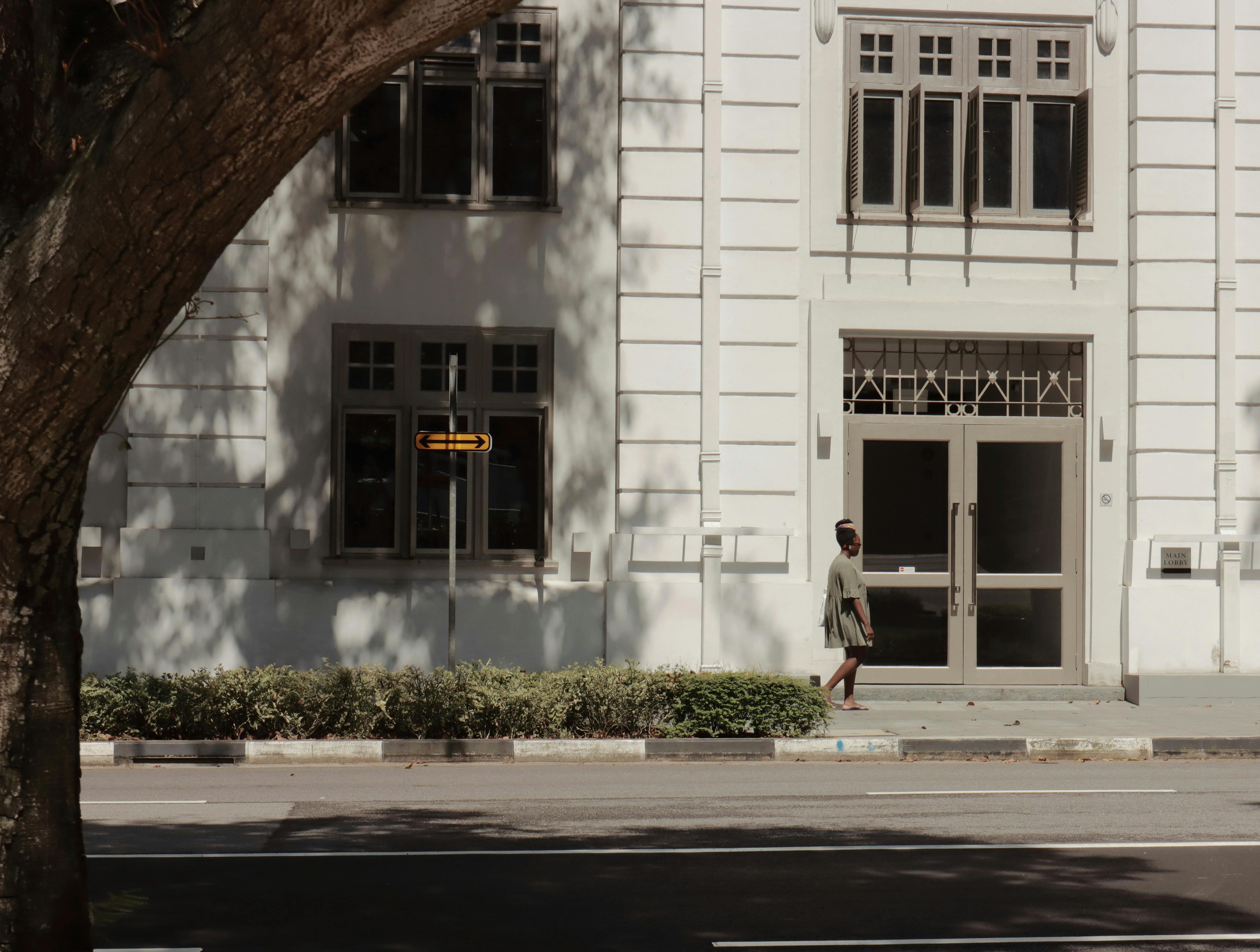Woman Walking near Street · Free Stock Photo
