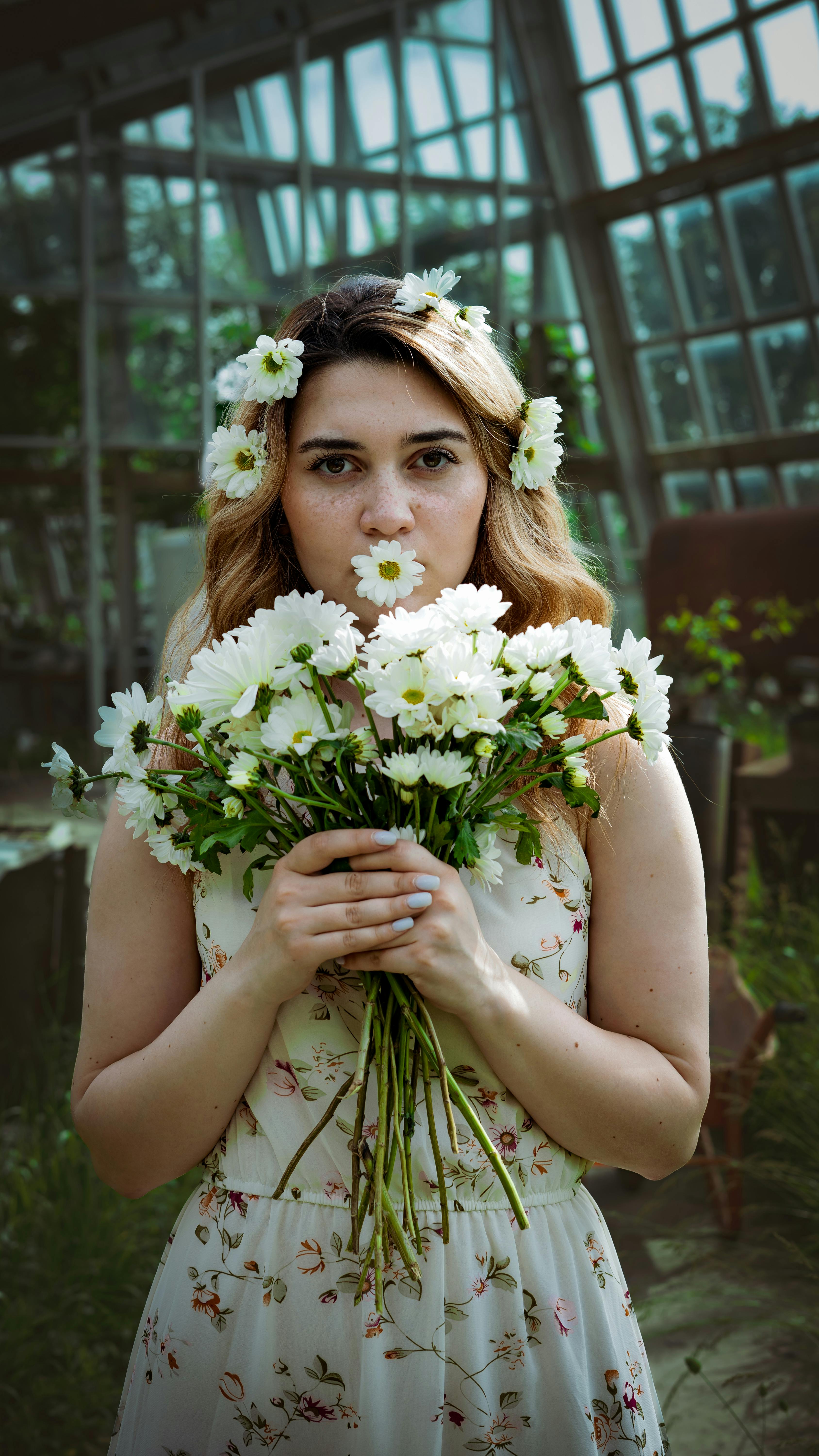 Woman in Floral Dress Holding Blooming White Flowers · Free Stock Photo