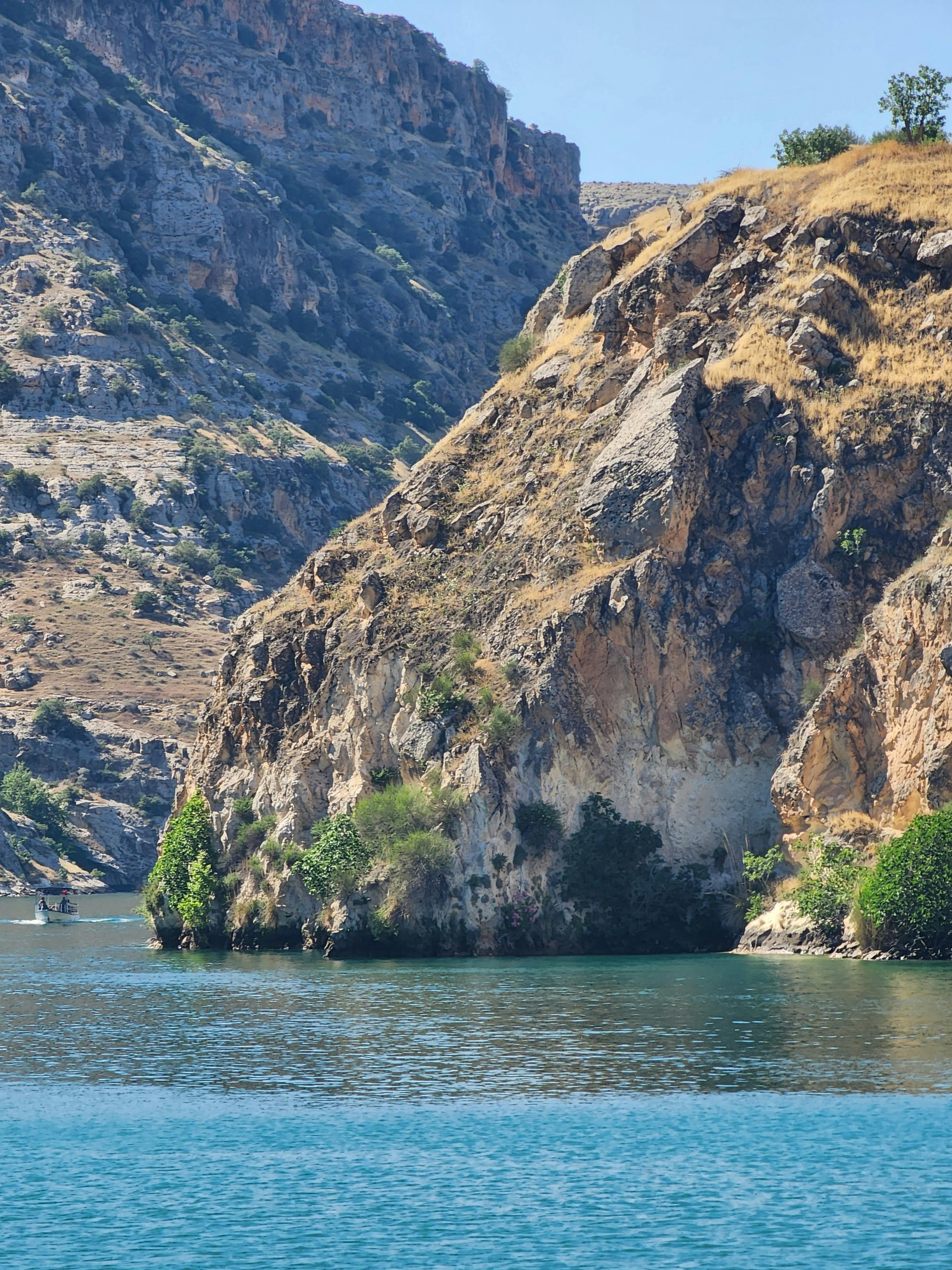 River Beside a Rocky Mountain · Free Stock Photo