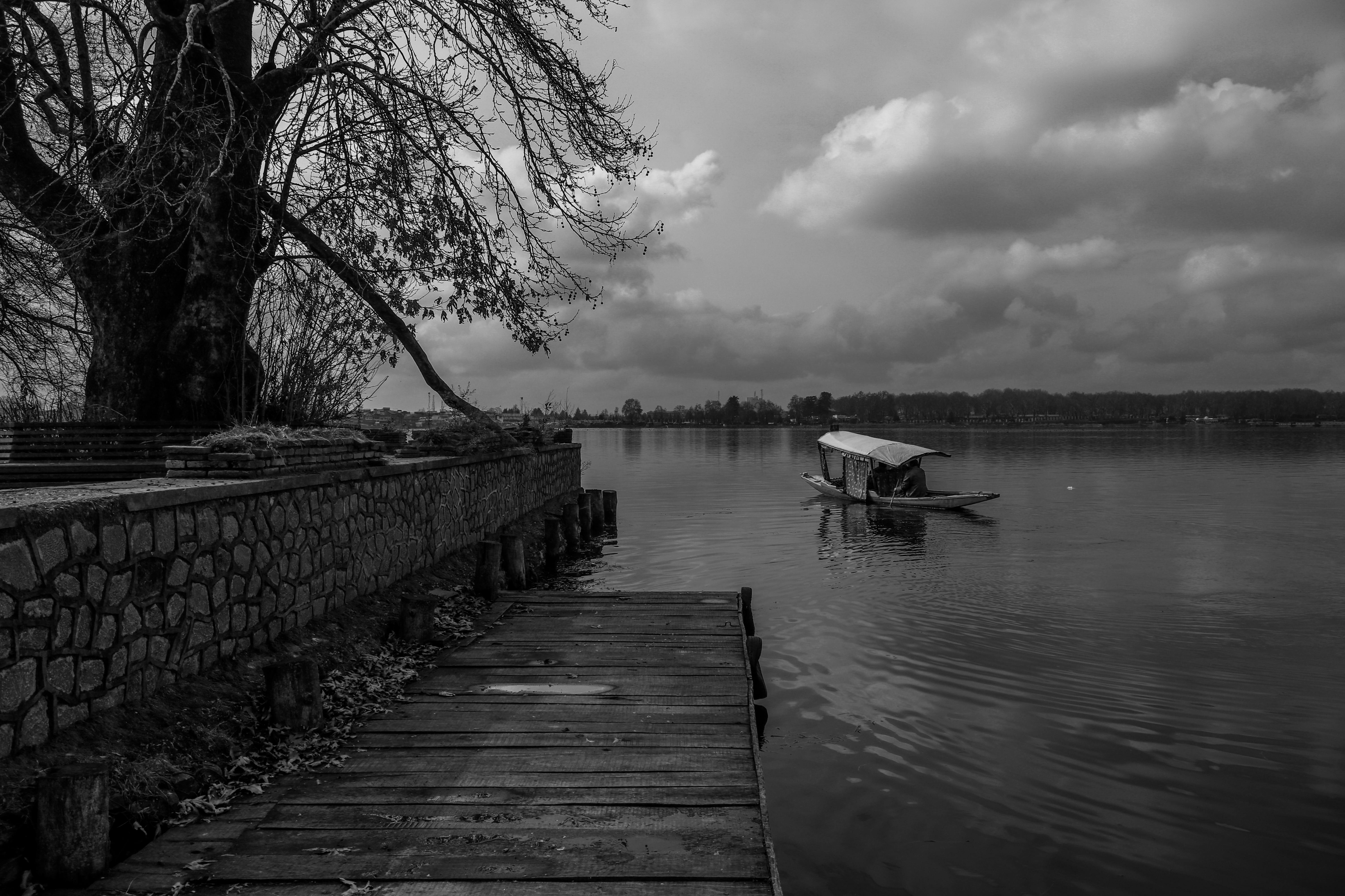 Grayscale Photography of a Boat Near the Lake · Free Stock Photo