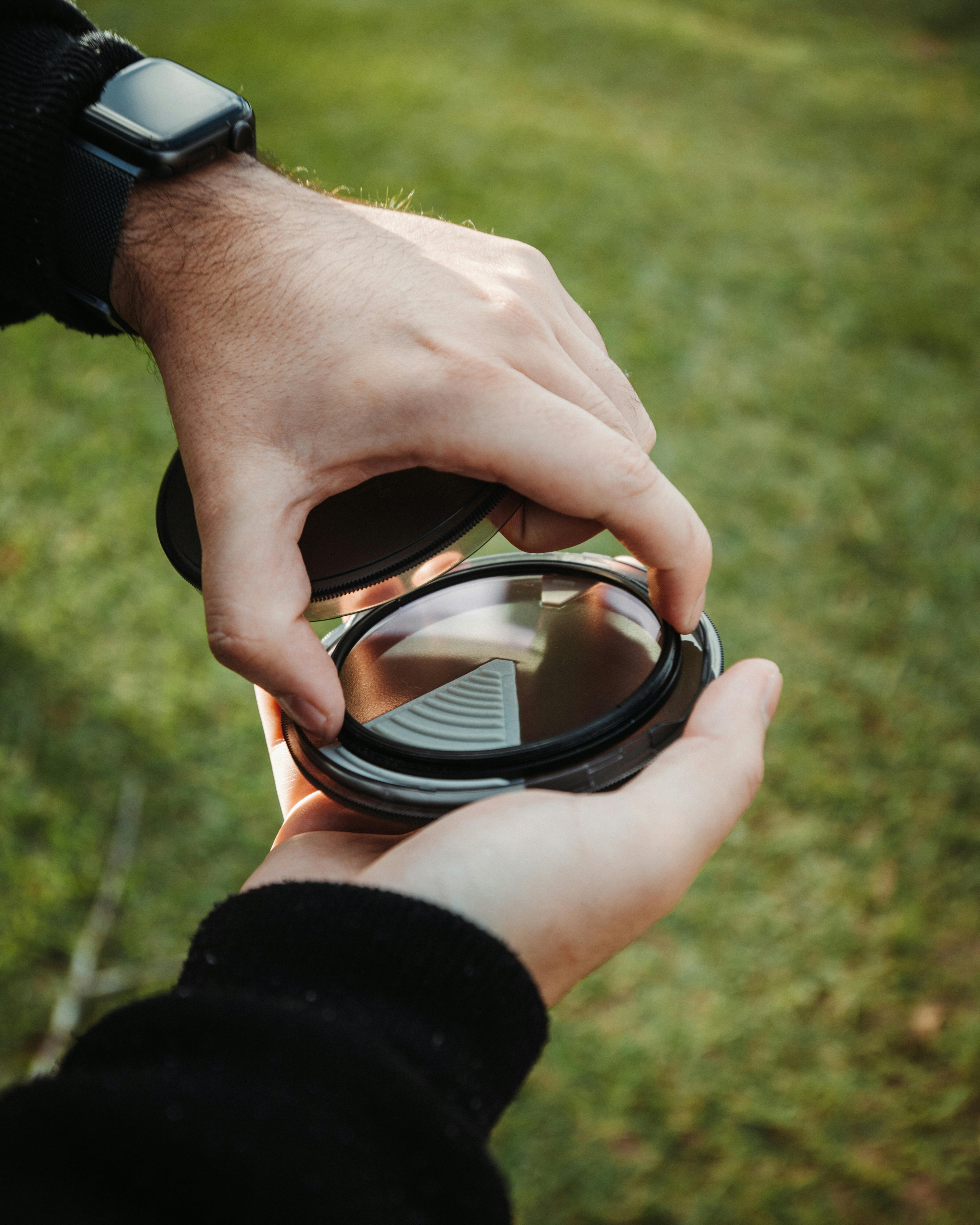 Close up of a Person Holding a Lens · Free Stock Photo