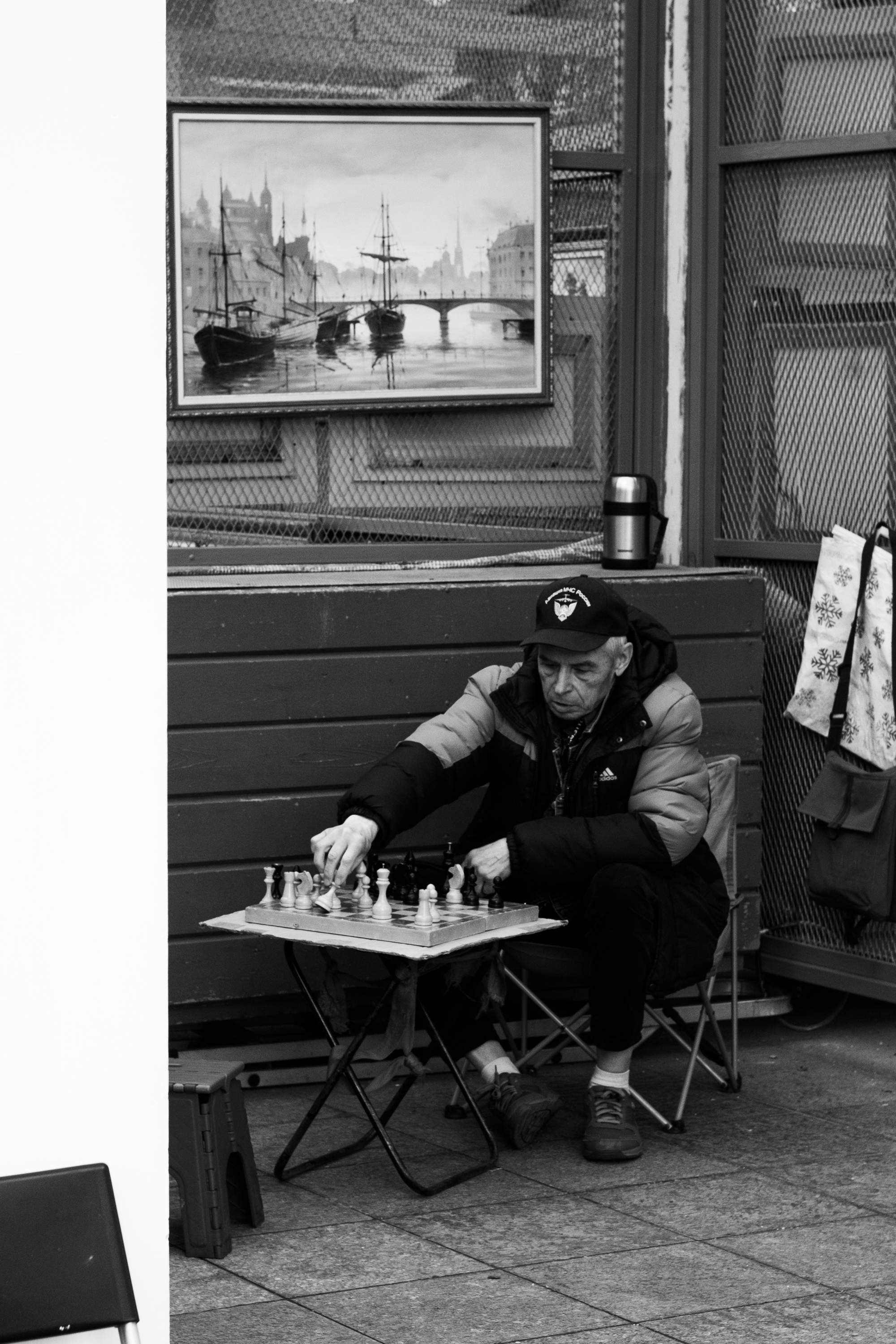 Grayscale Photo of a Man Sitting on Chair Playing Chess · Free Stock Photo