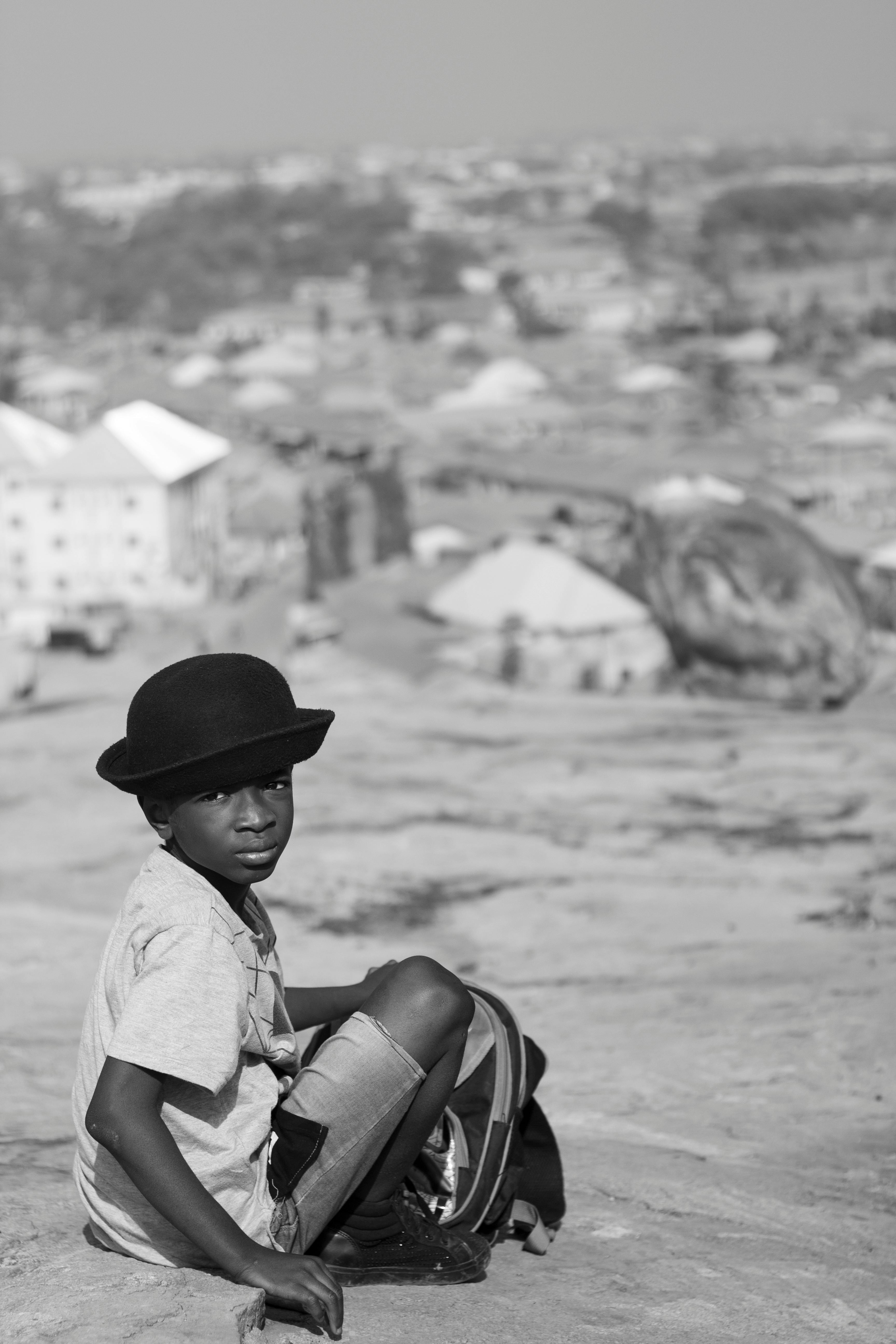 Grayscale Photo of a Kid Wearing a hat · Free Stock Photo