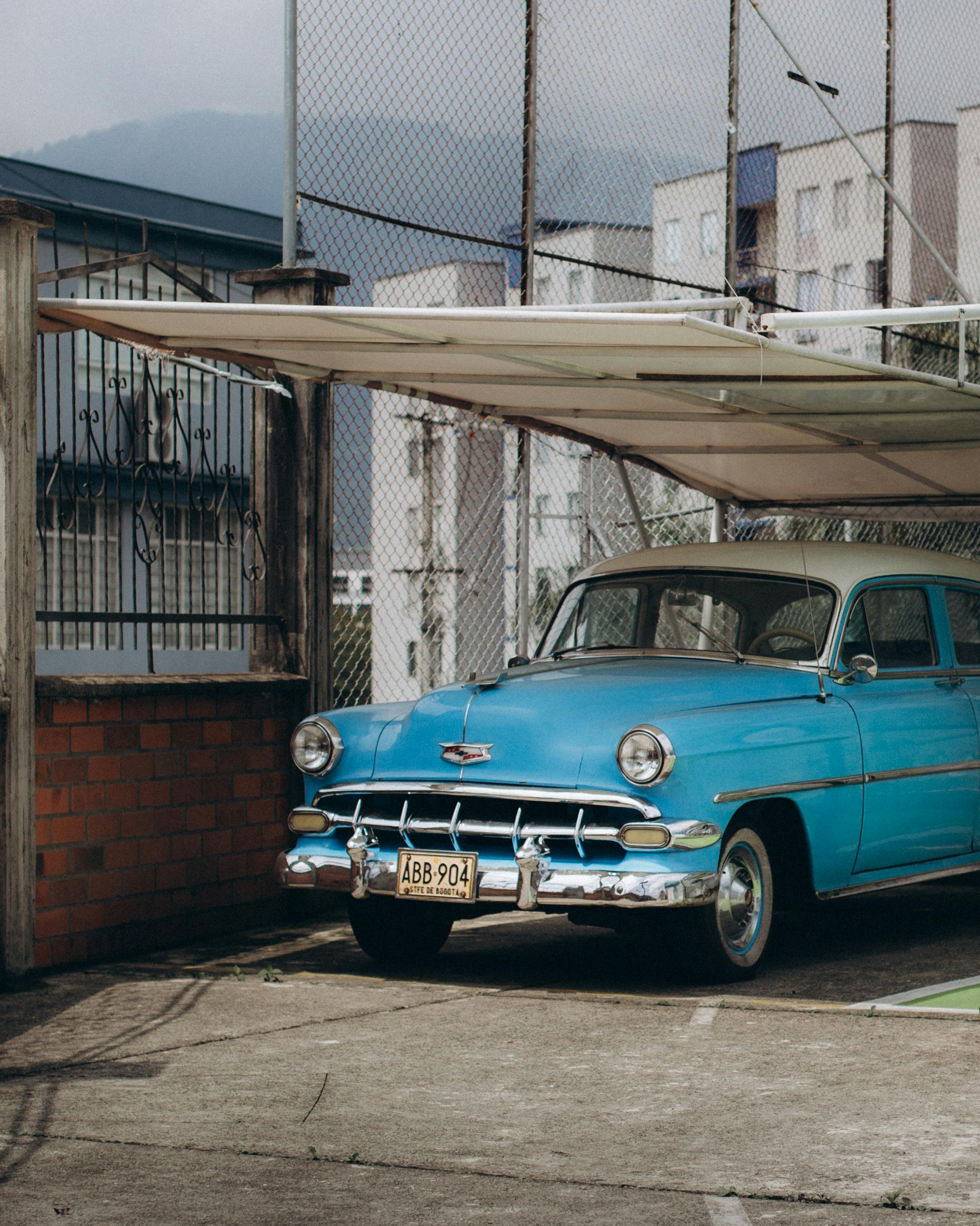 Blue Car Parked Under White Roof · Free Stock Photo