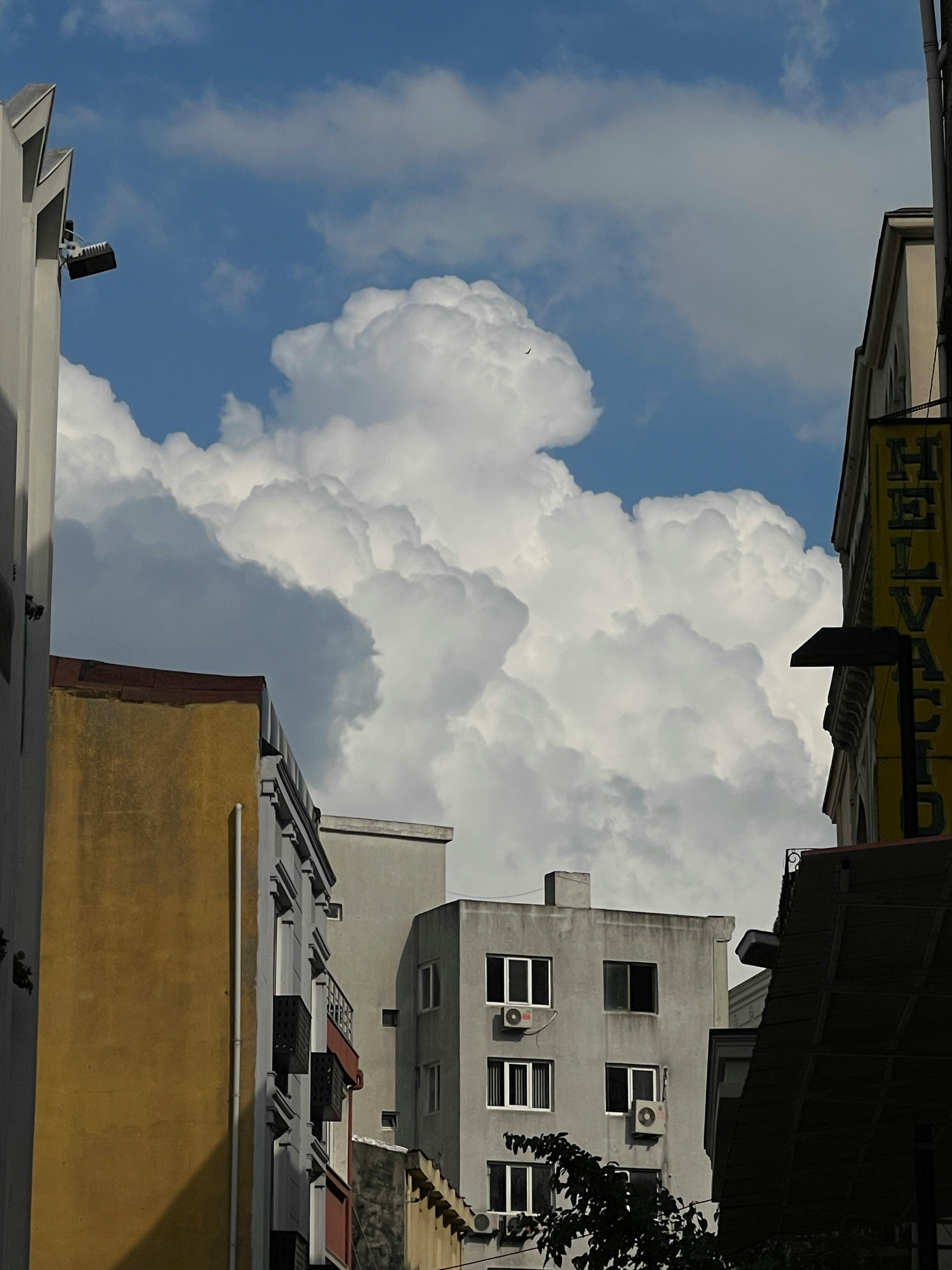 Clouds over Buildings in Town · Free Stock Photo