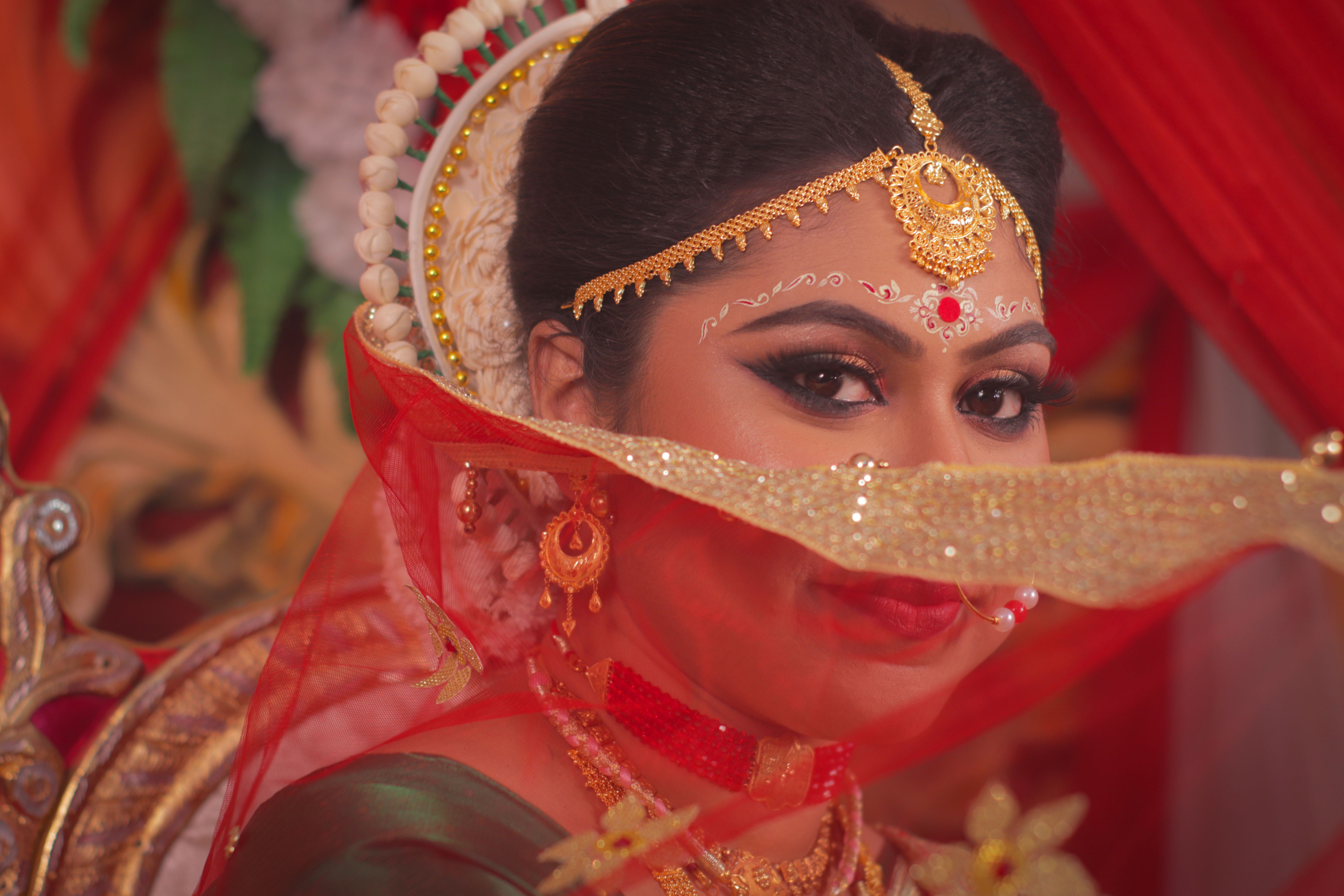 Beautiful Bride behind a Red Veil · Free Stock Photo