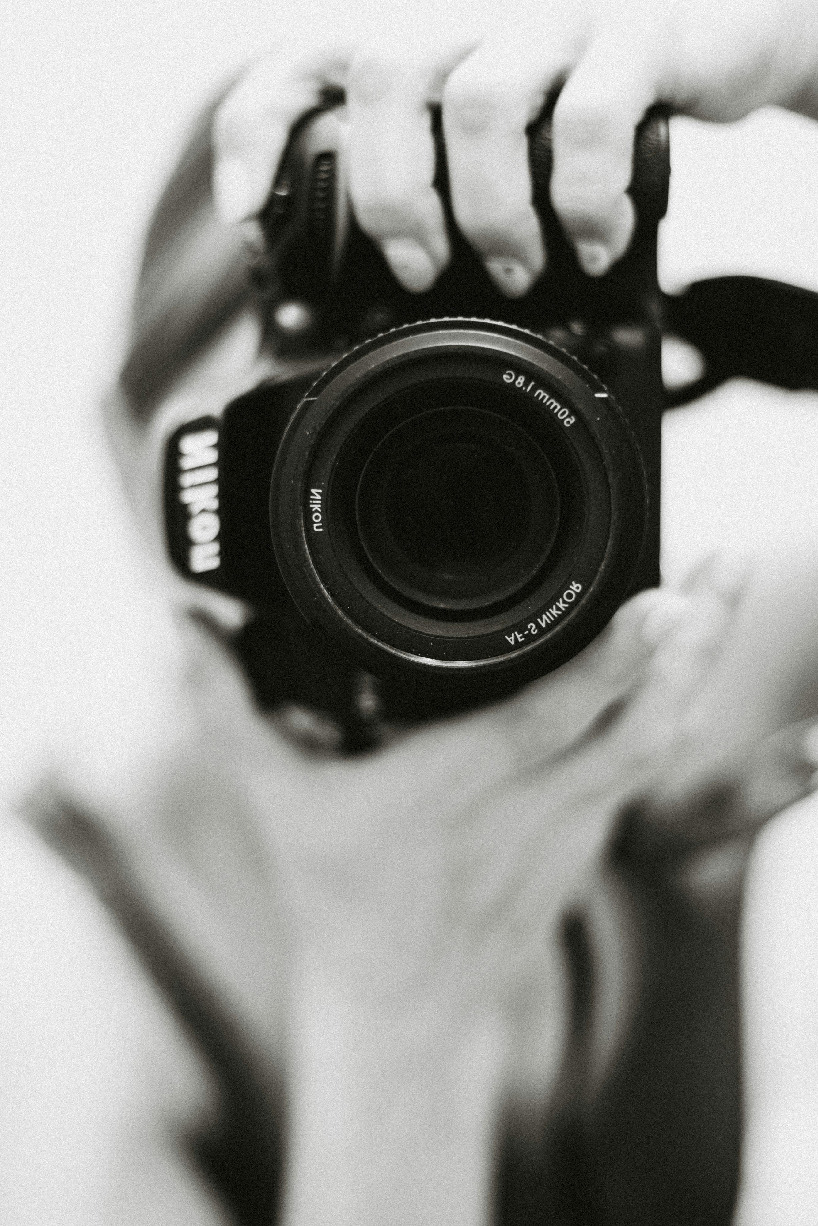 Photography of Person Holding Black Camera Lens · Free Stock Photo