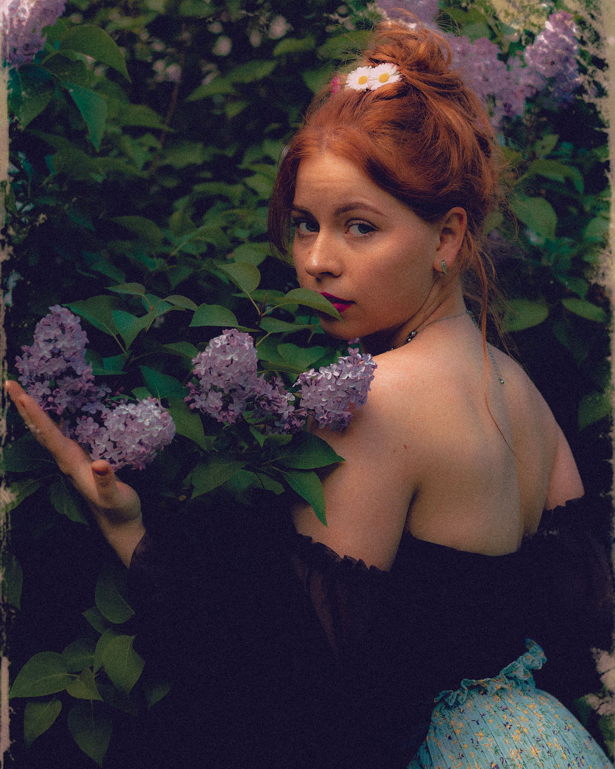 Photo of a Woman Near Lilac Flowers · Free Stock Photo