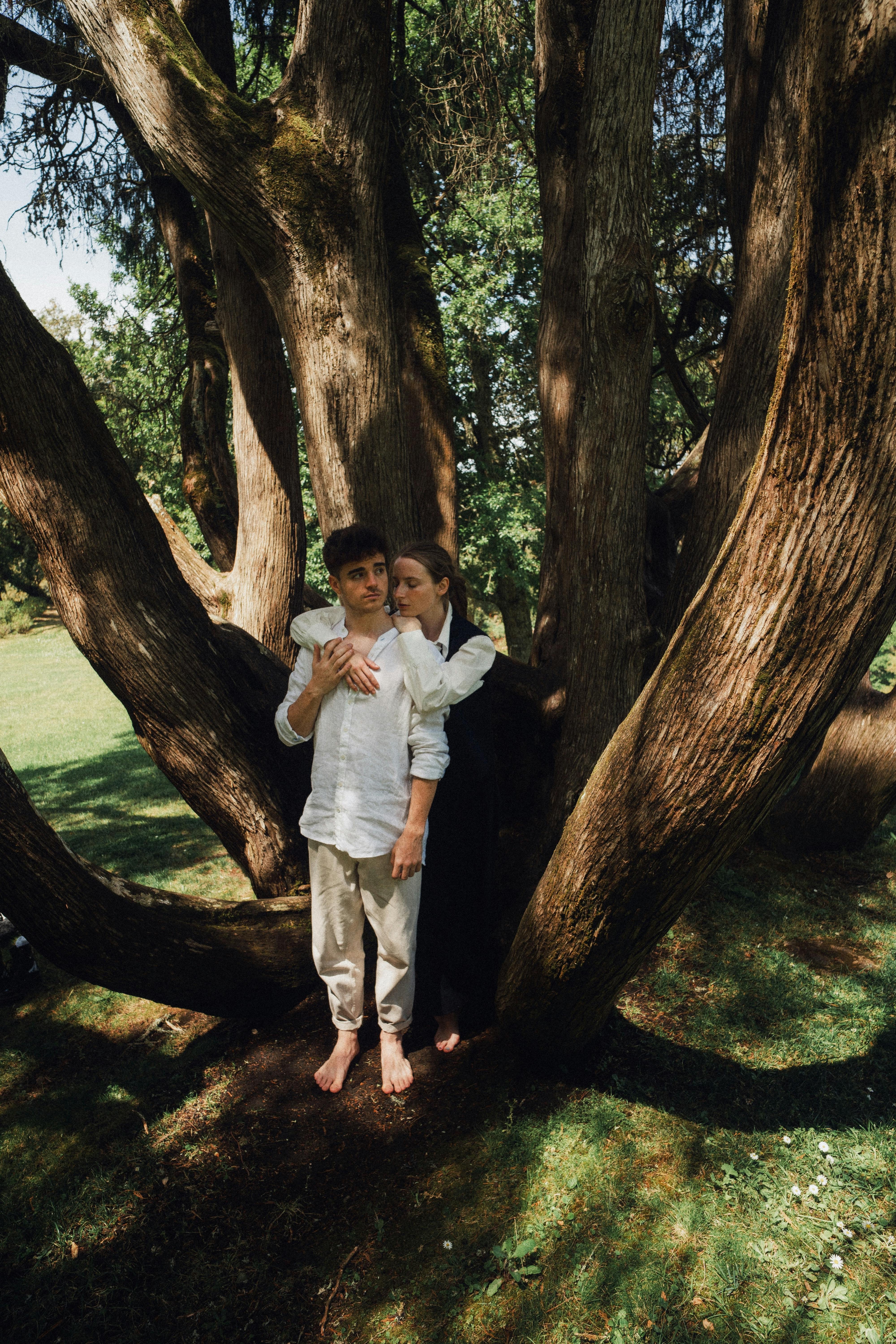 Couple Hugging by Building · Free Stock Photo