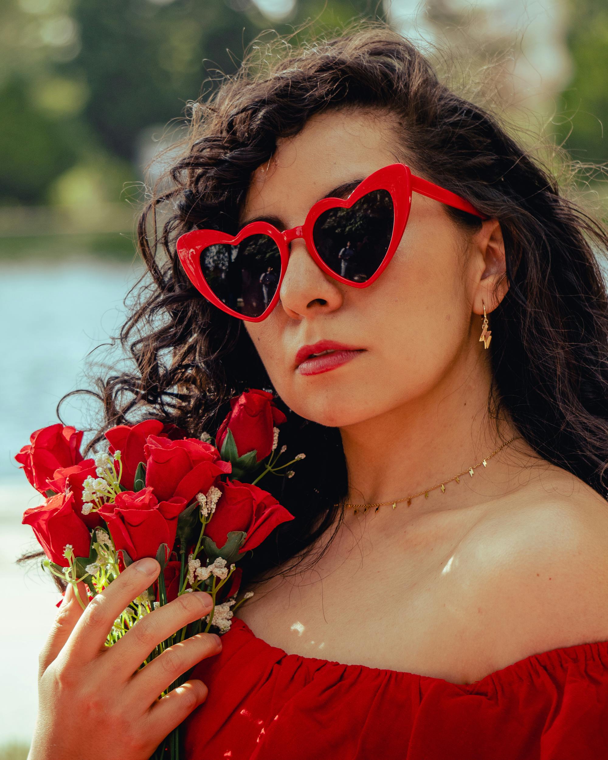 Person with Red Roses by Sea · Free Stock Photo