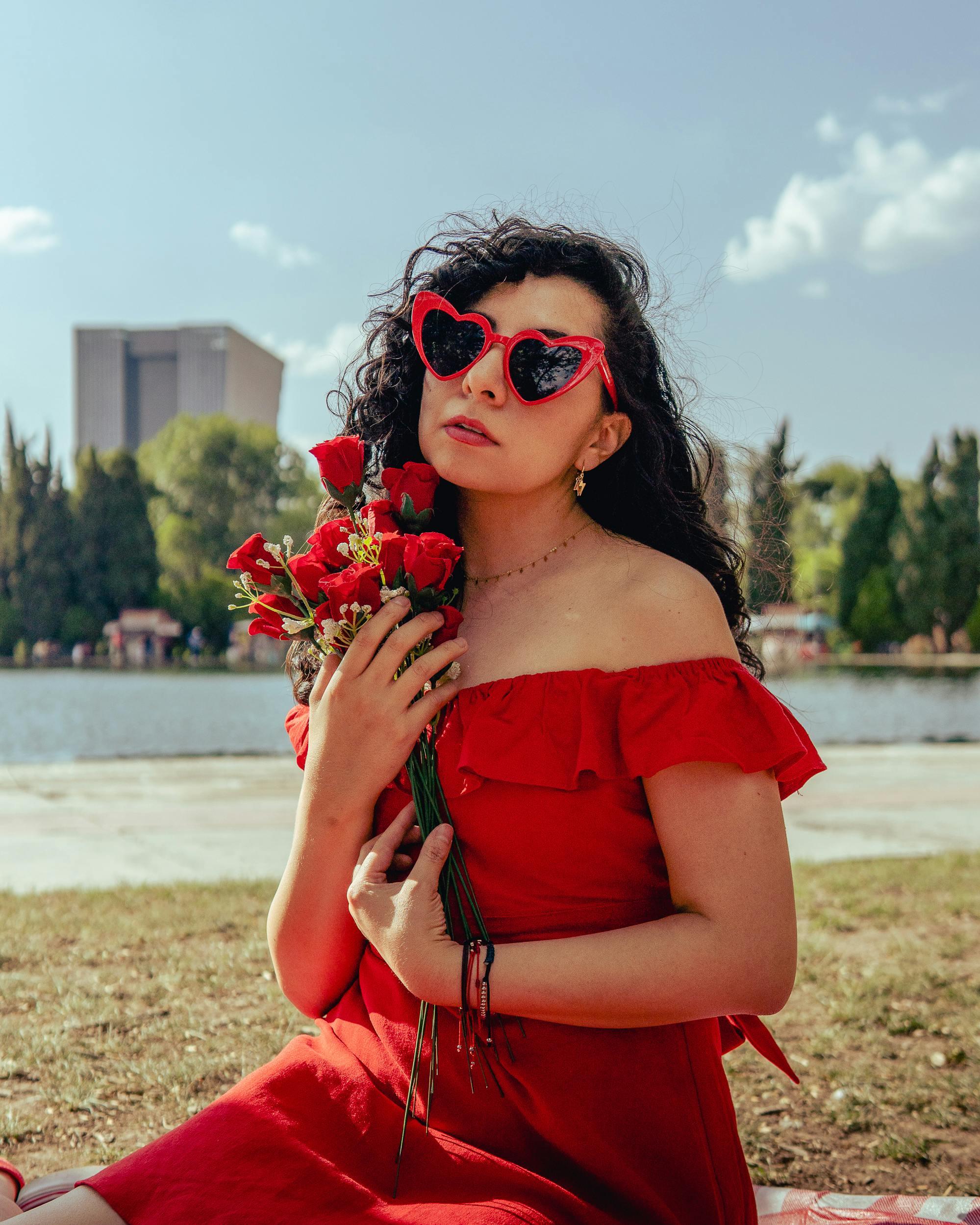 Woman in red Dress Holding a Bouquet of Red Roses · Free Stock Photo