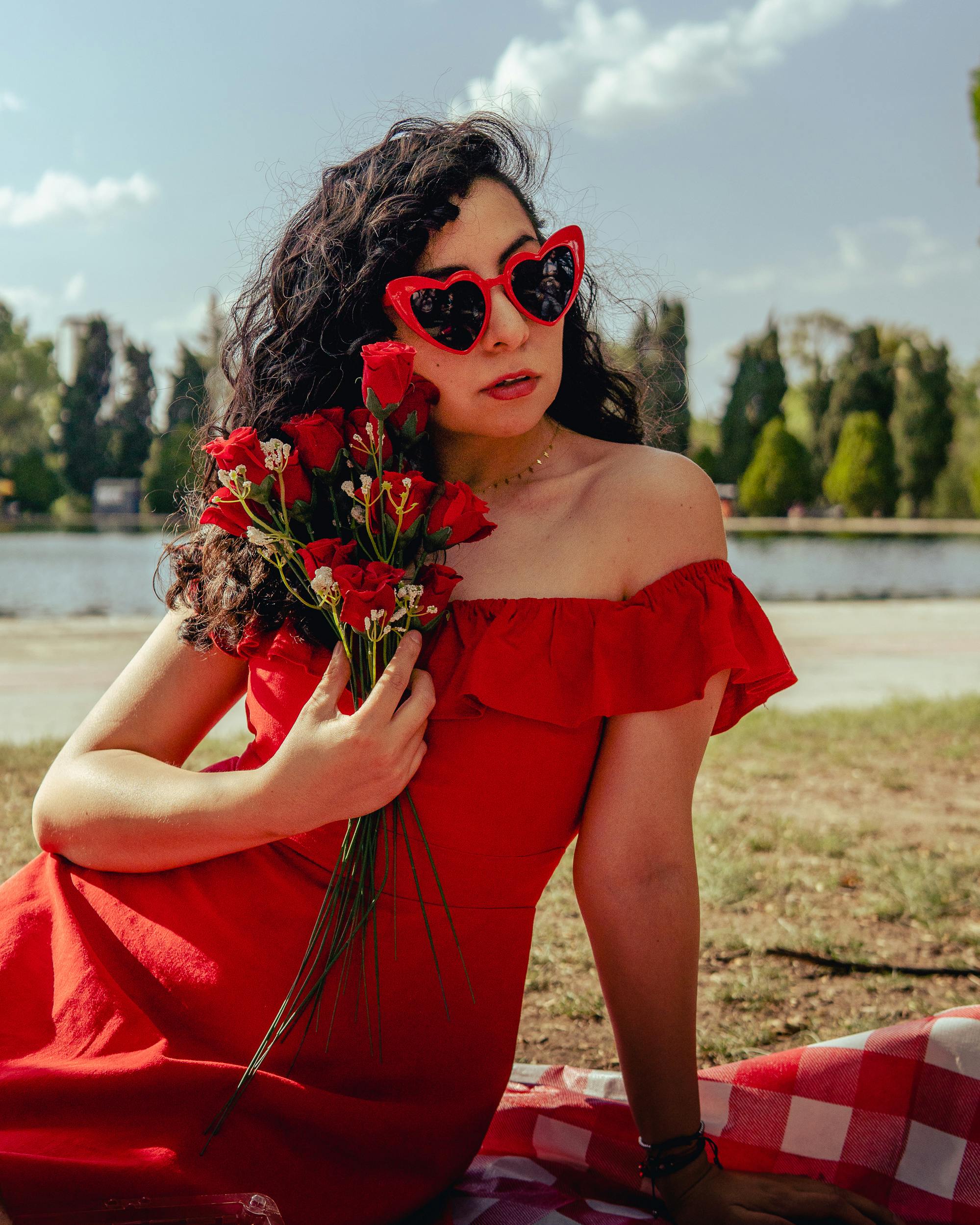 Person with Red Roses by Sea · Free Stock Photo