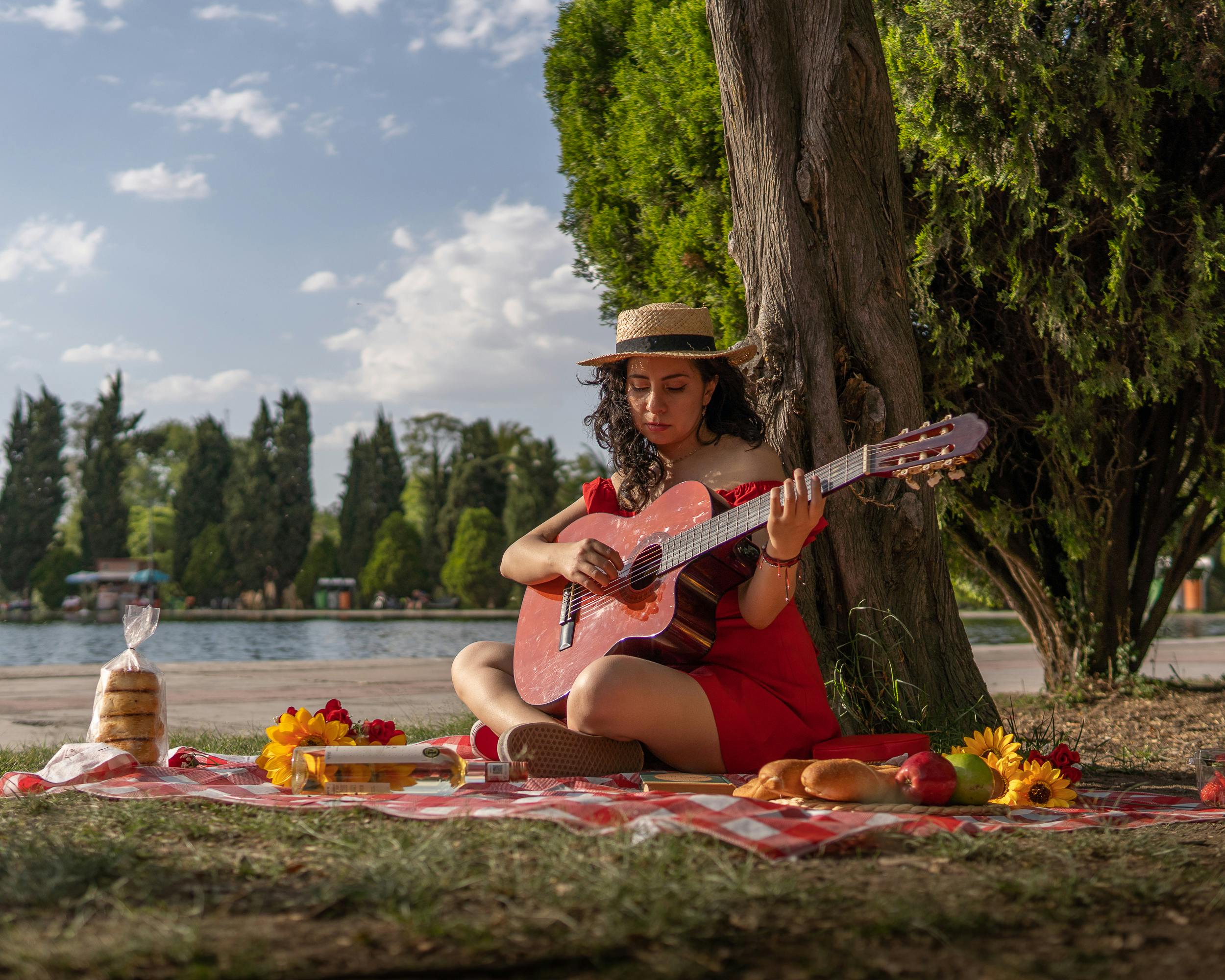 Photo of a Young Woman Sitting and Playing an Electric Guitar · Free ...