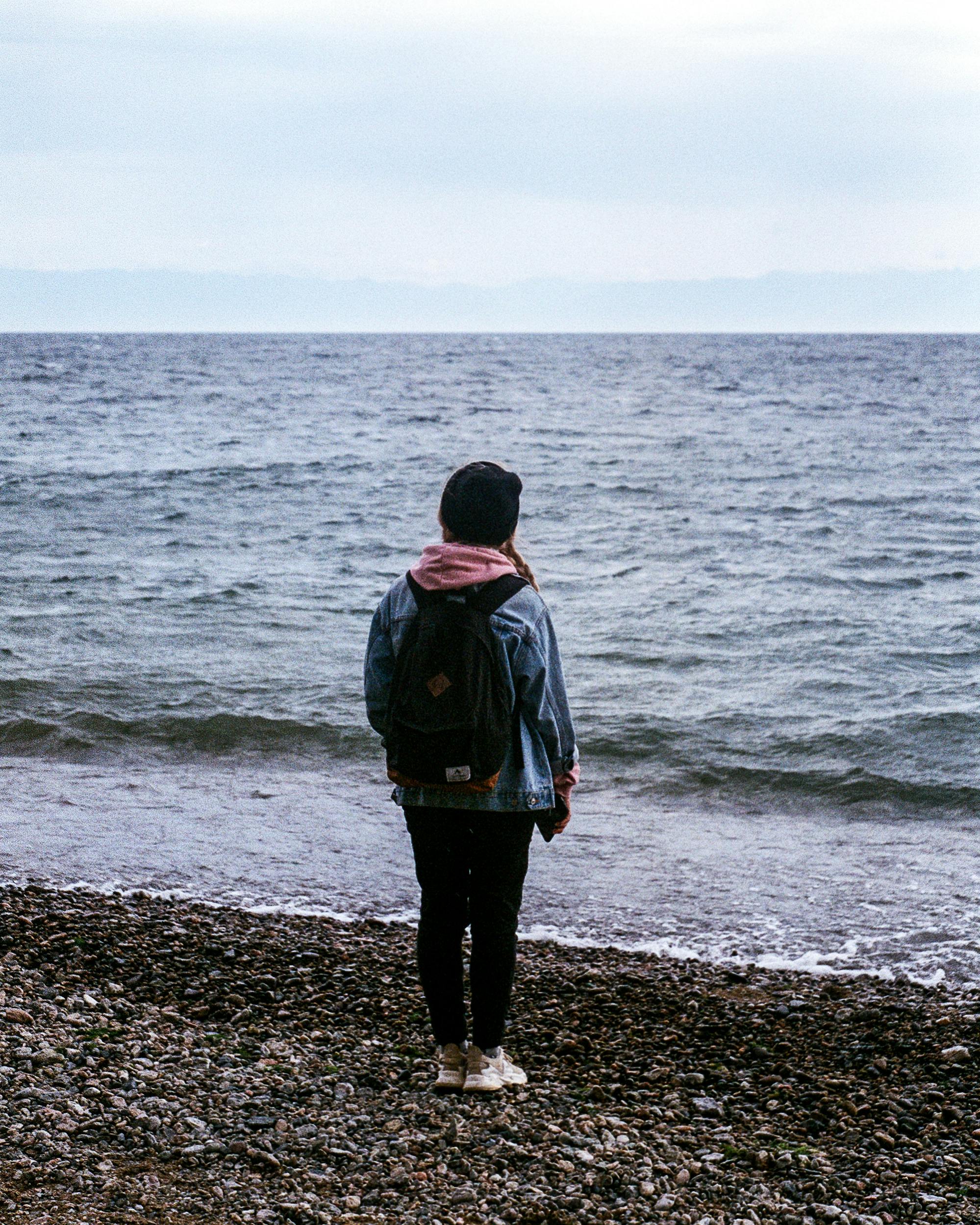A Person Standing Between Boulders · Free Stock Photo