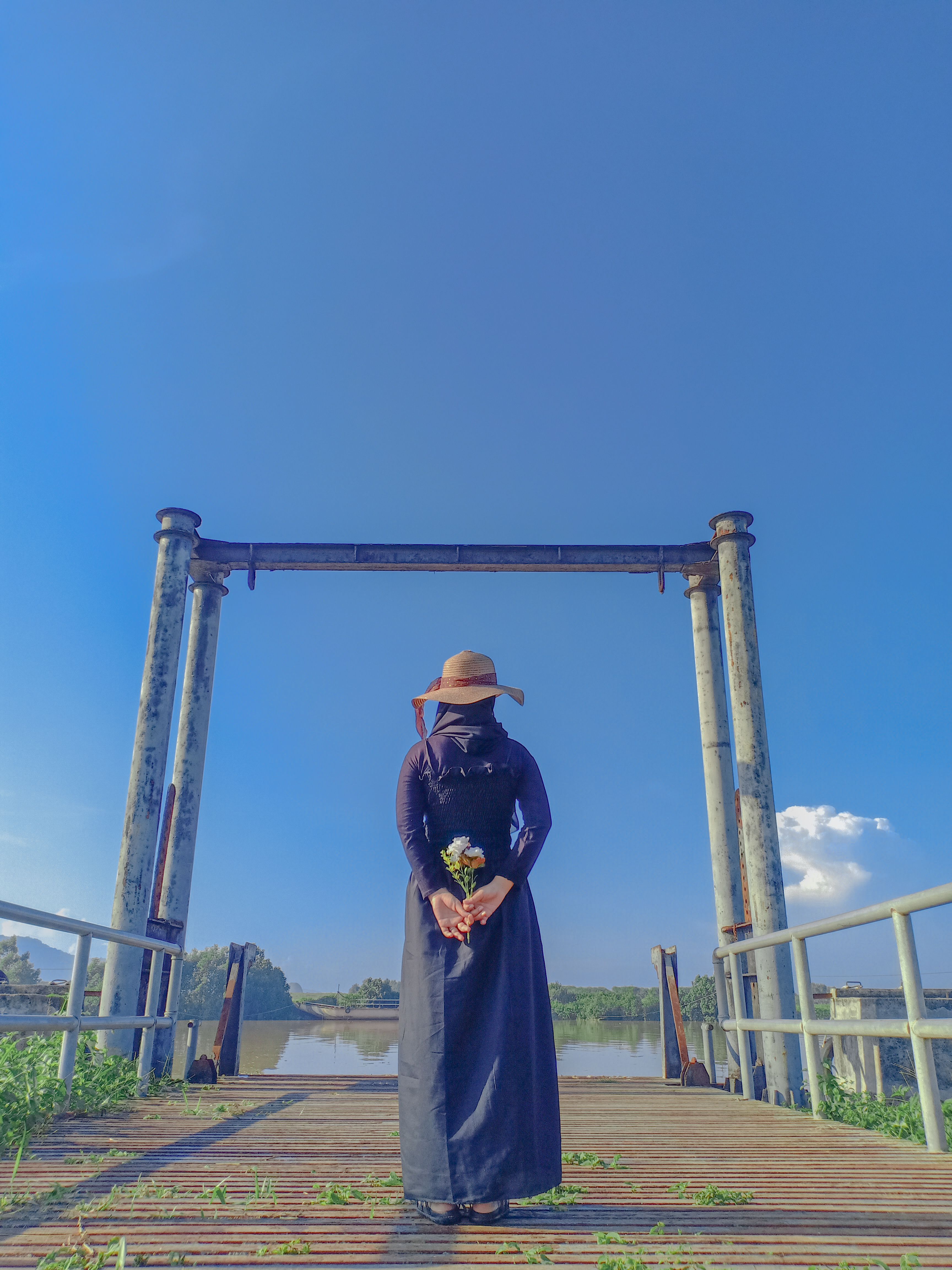 Woman Hiding Flowers behind Back · Free Stock Photo