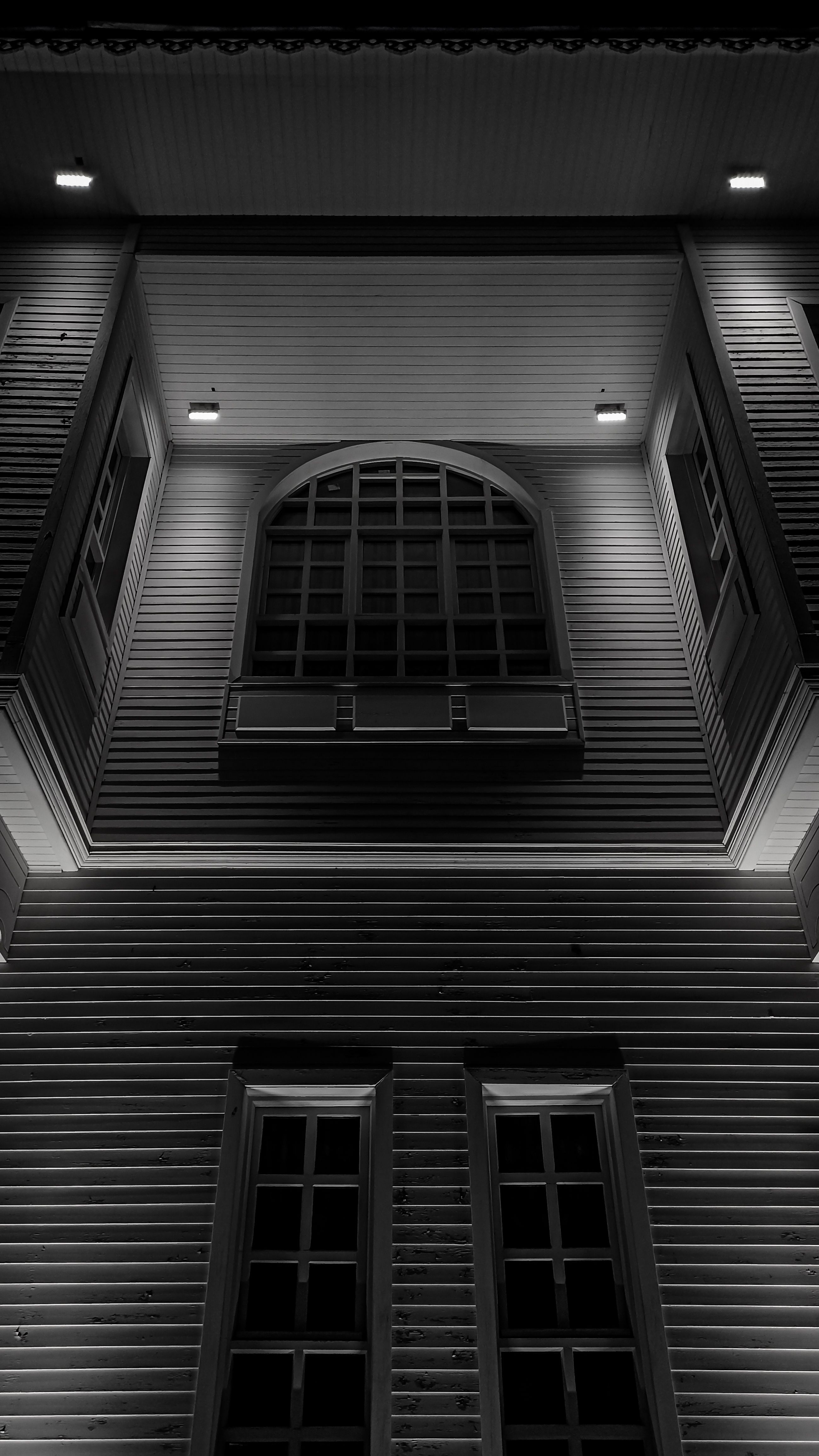 Grayscale Photo of an Arched Window with Lighting · Free Stock Photo