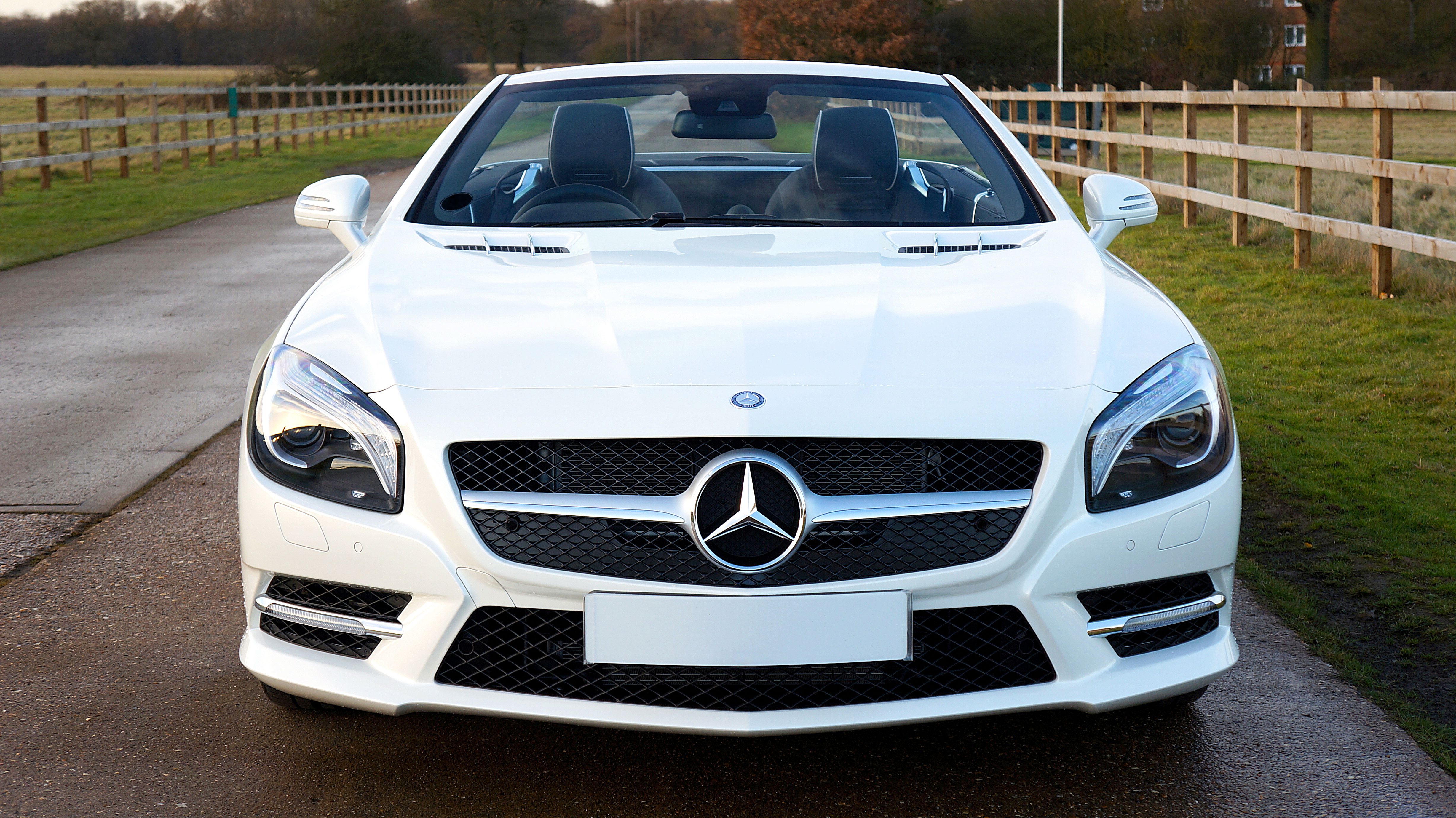 Silver Mercedez Benz Convertible on Brown Concrete Road · Free Stock Photo