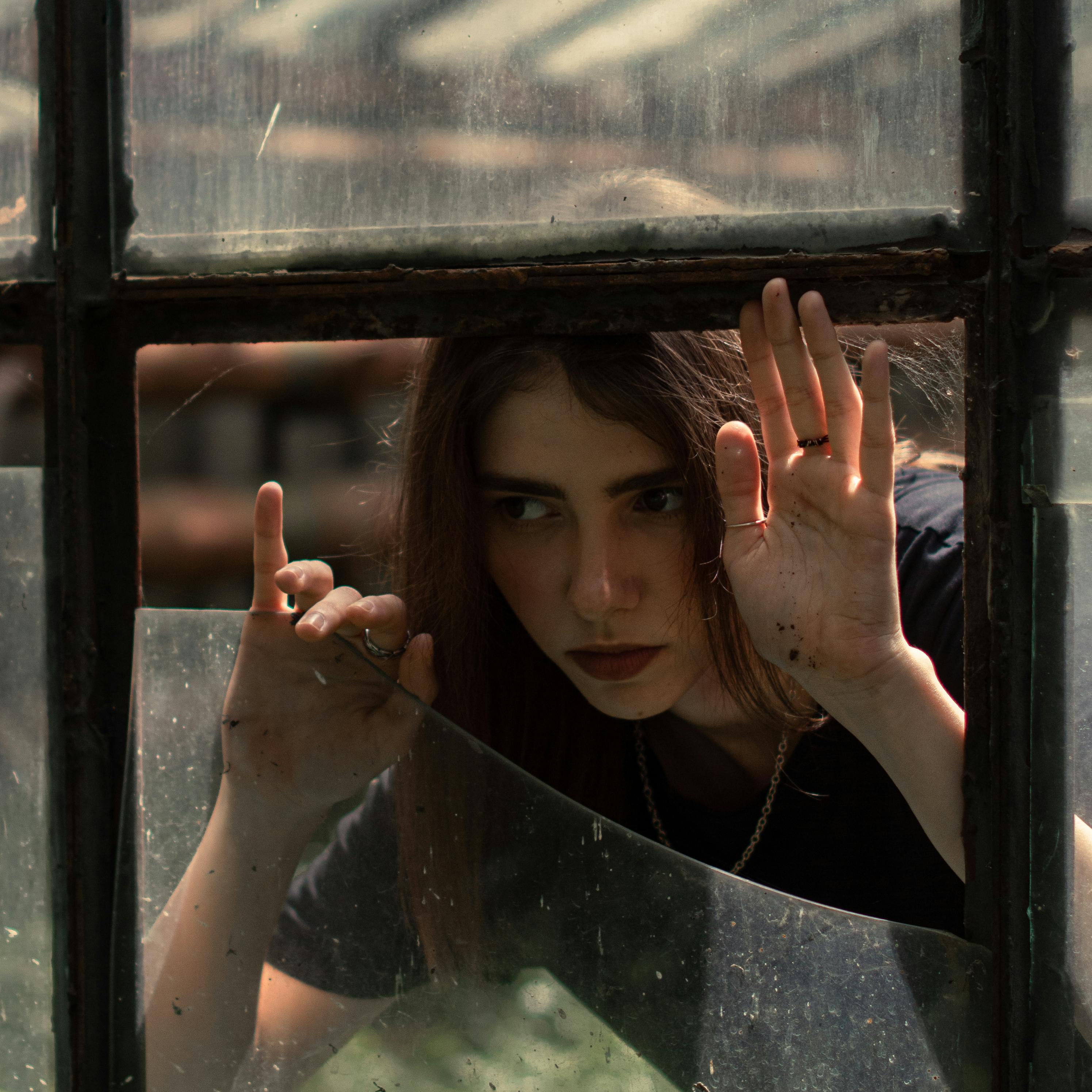 Women Peeking through Broken Window · Free Stock Photo