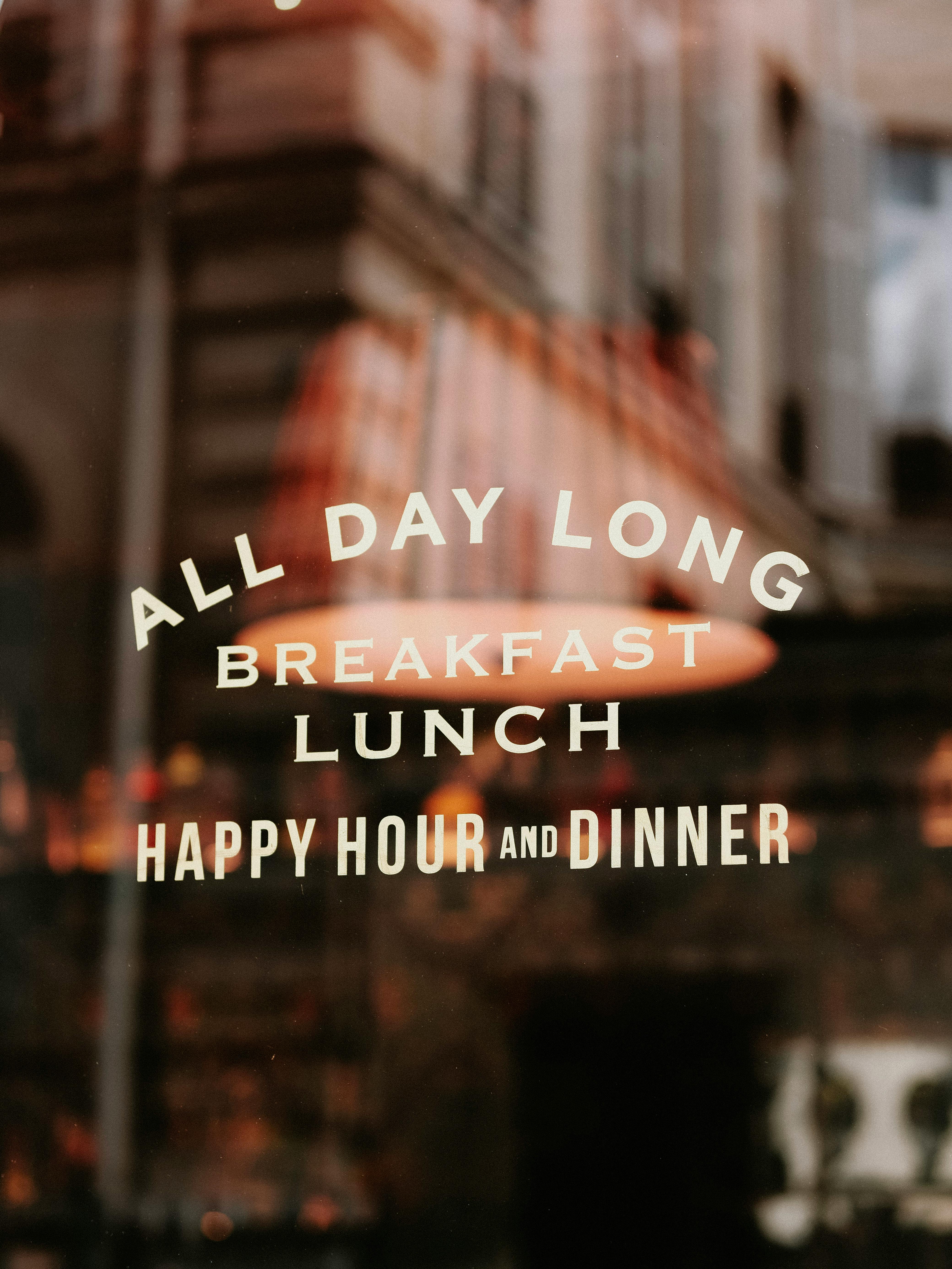 Advertisement Text on Restaurant Window · Free Stock Photo