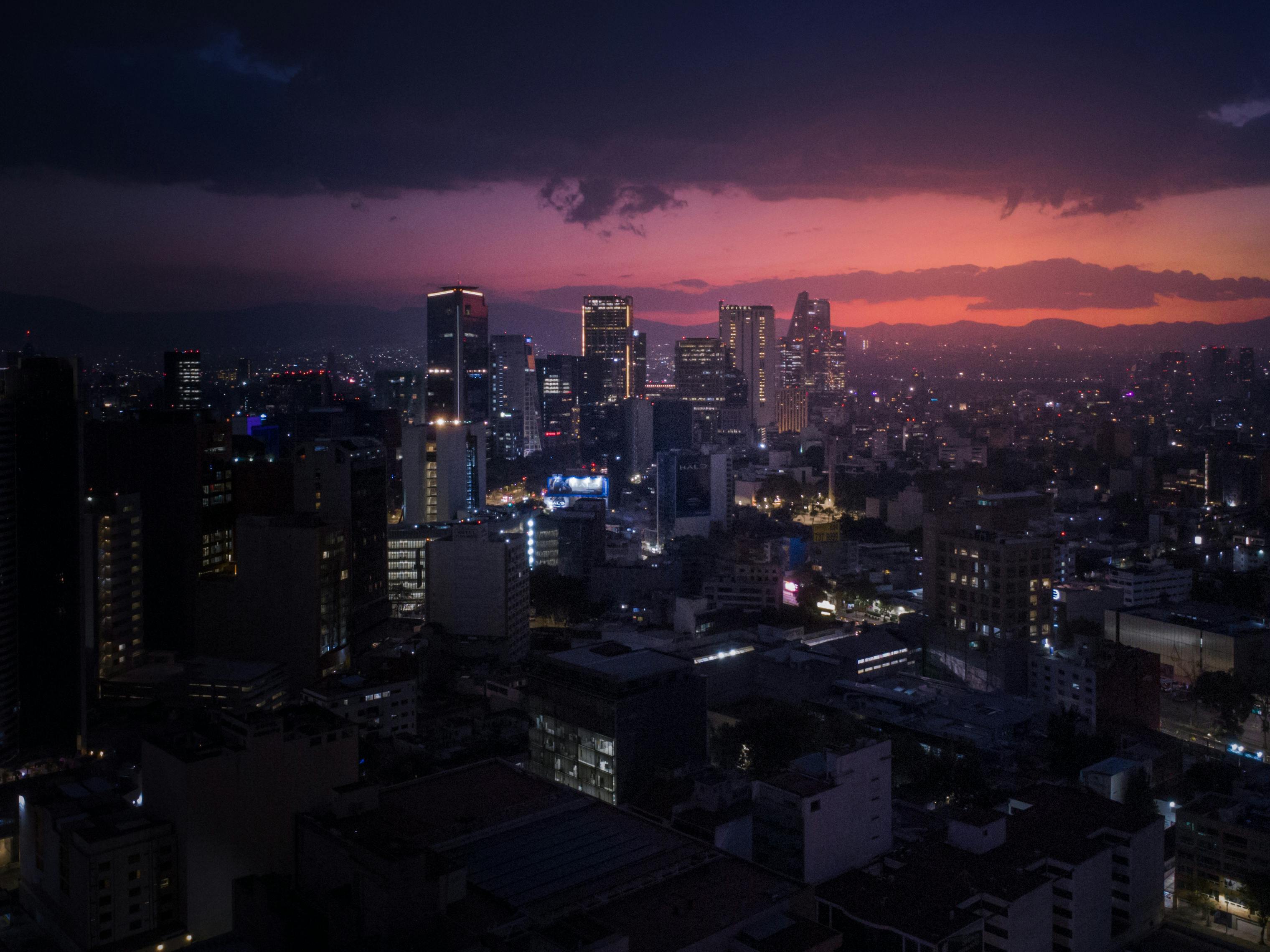 People Walking Near High Rise Buildings During Night Time · Free Stock ...