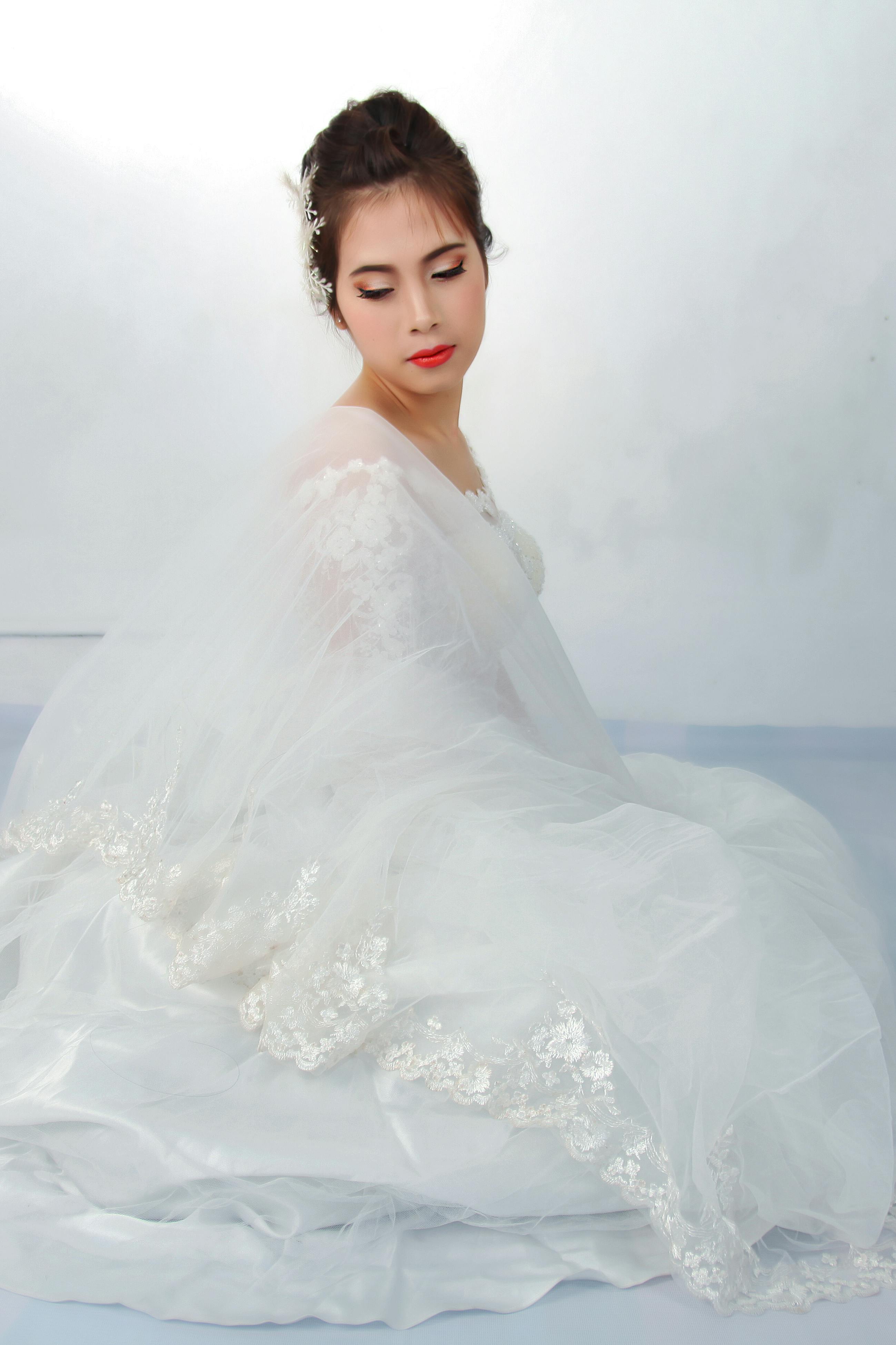 Woman Wearing Teal Dress in Reclining Position · Free Stock Photo