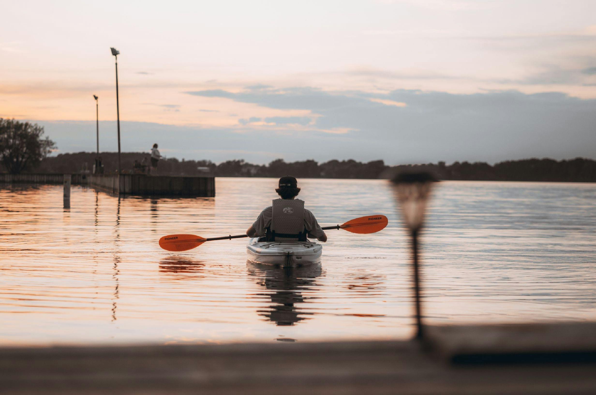 Man in Canoe at Sunset · Free Stock Photo
