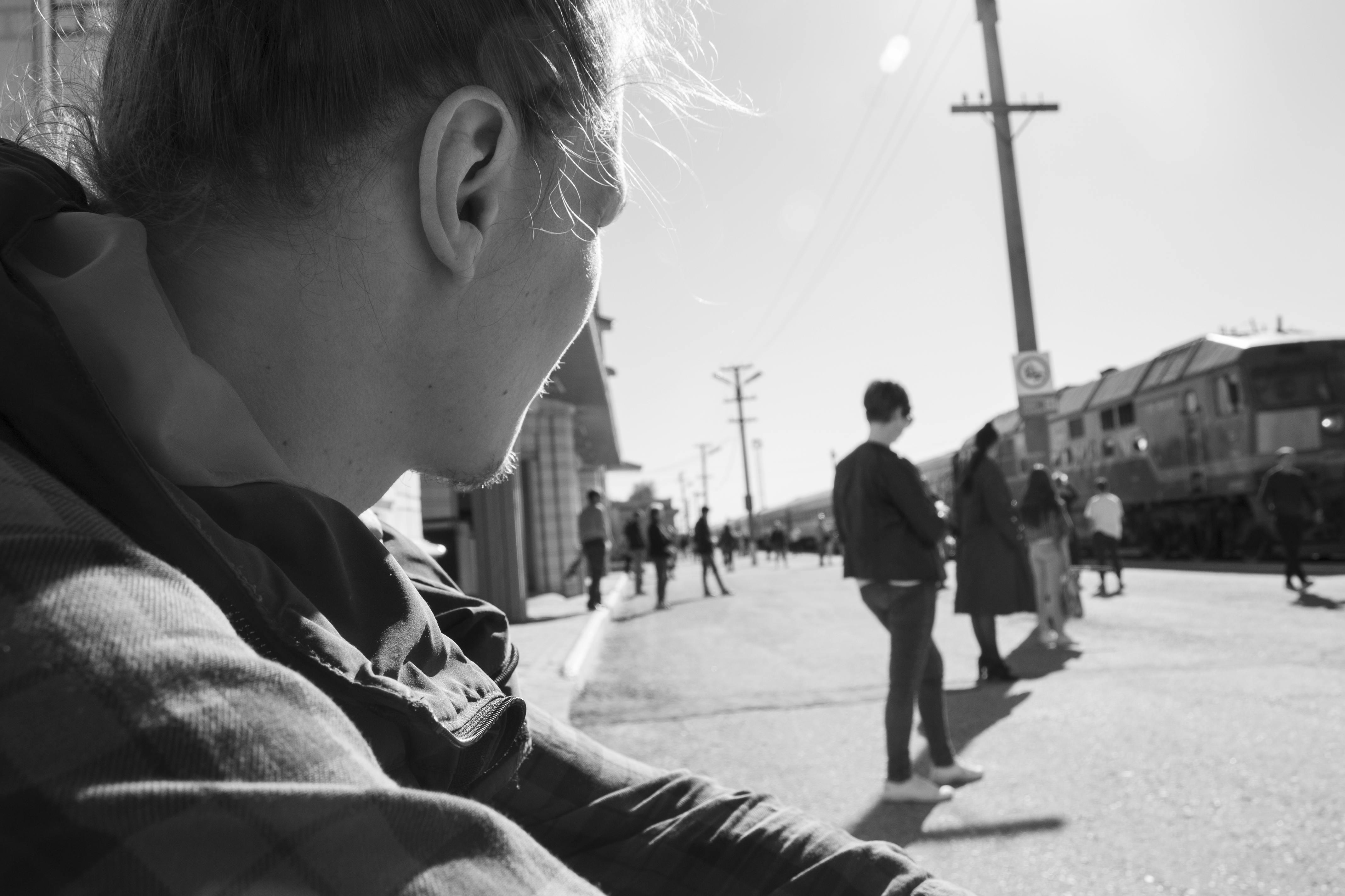 A Person Looking at the People on the Street · Free Stock Photo