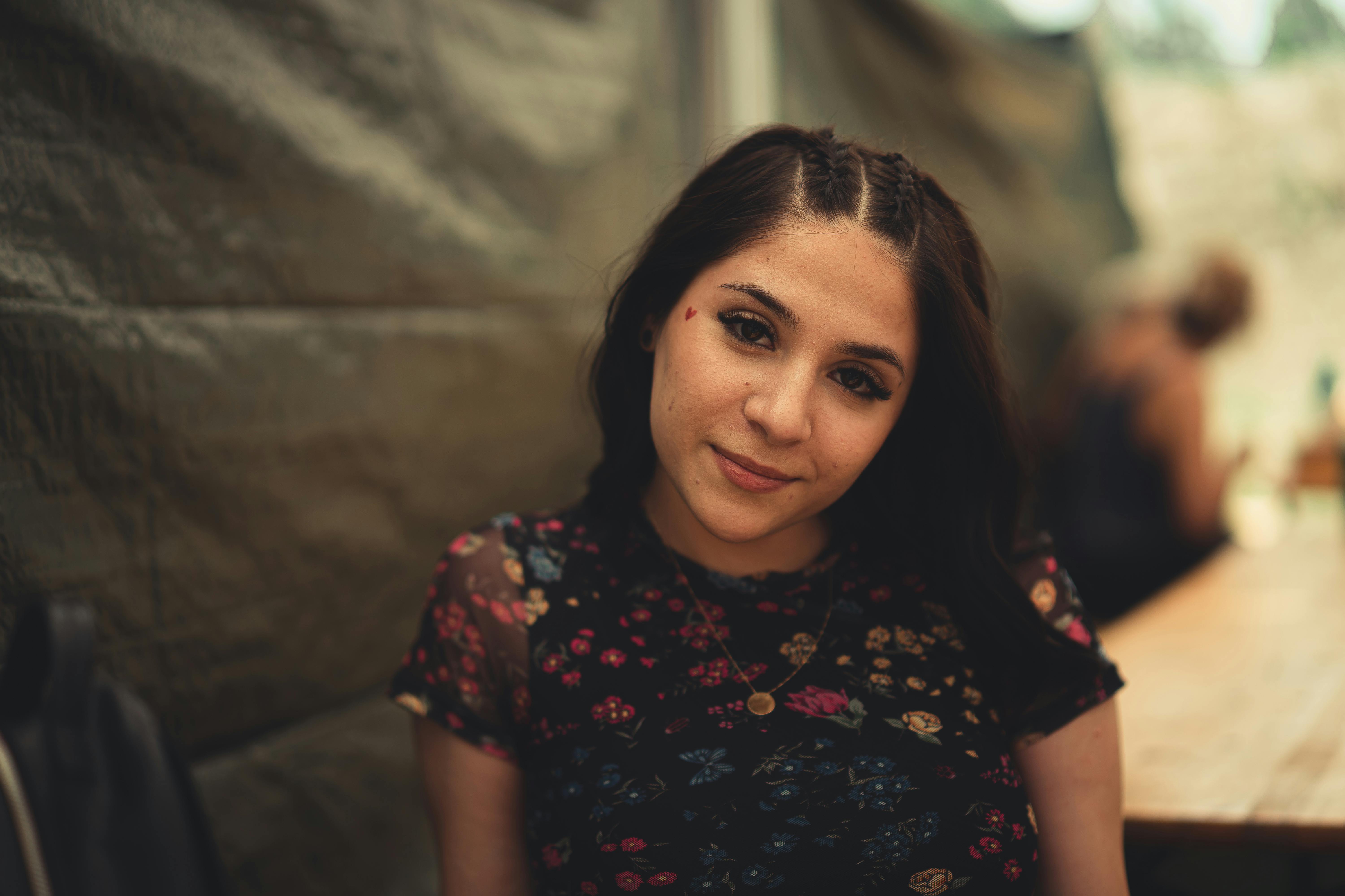 Portrait of Woman in White Blouse through a Window · Free Stock Photo