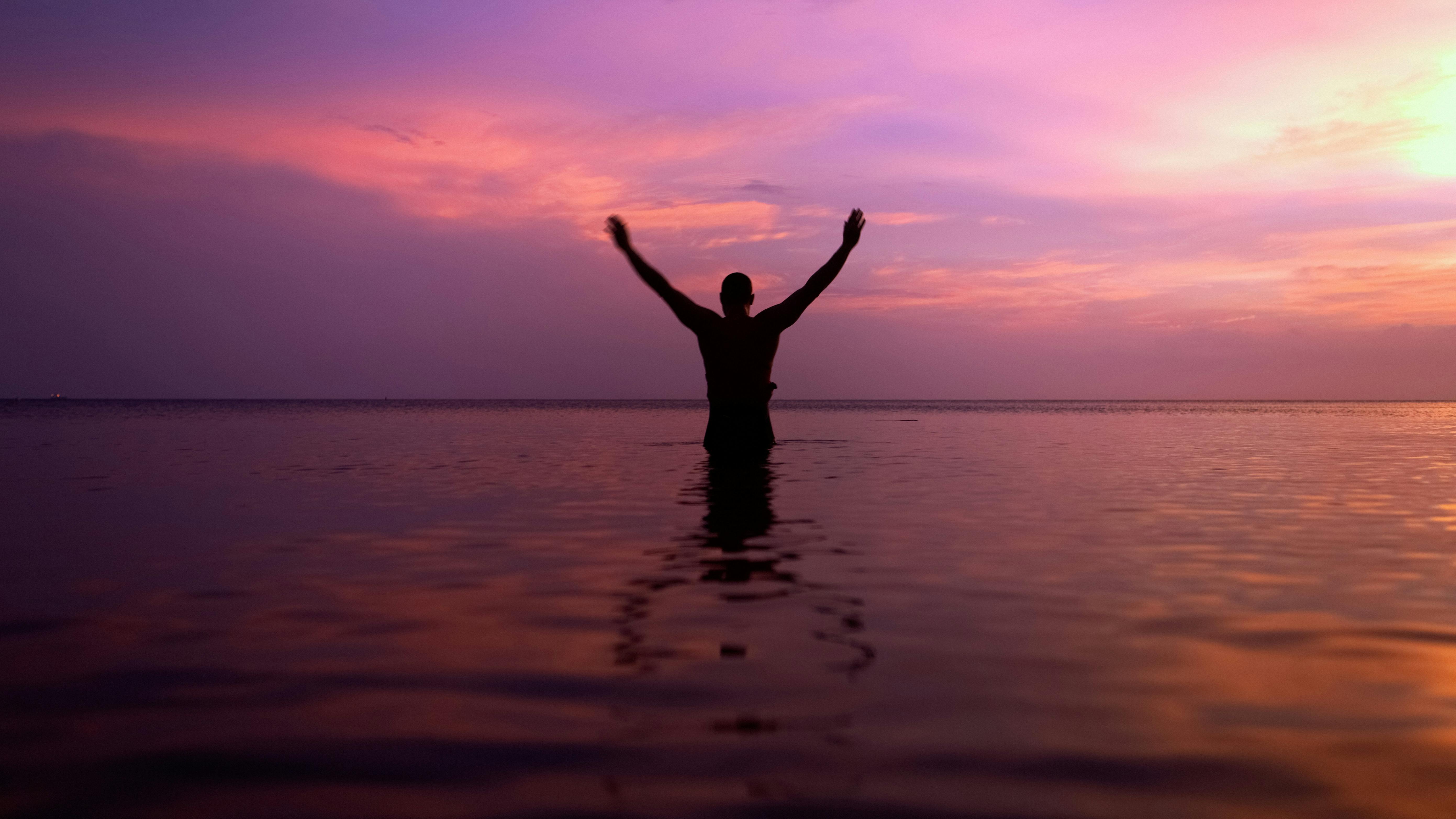 Silhouette of People Raising Their Graduation Hats · Free Stock Photo