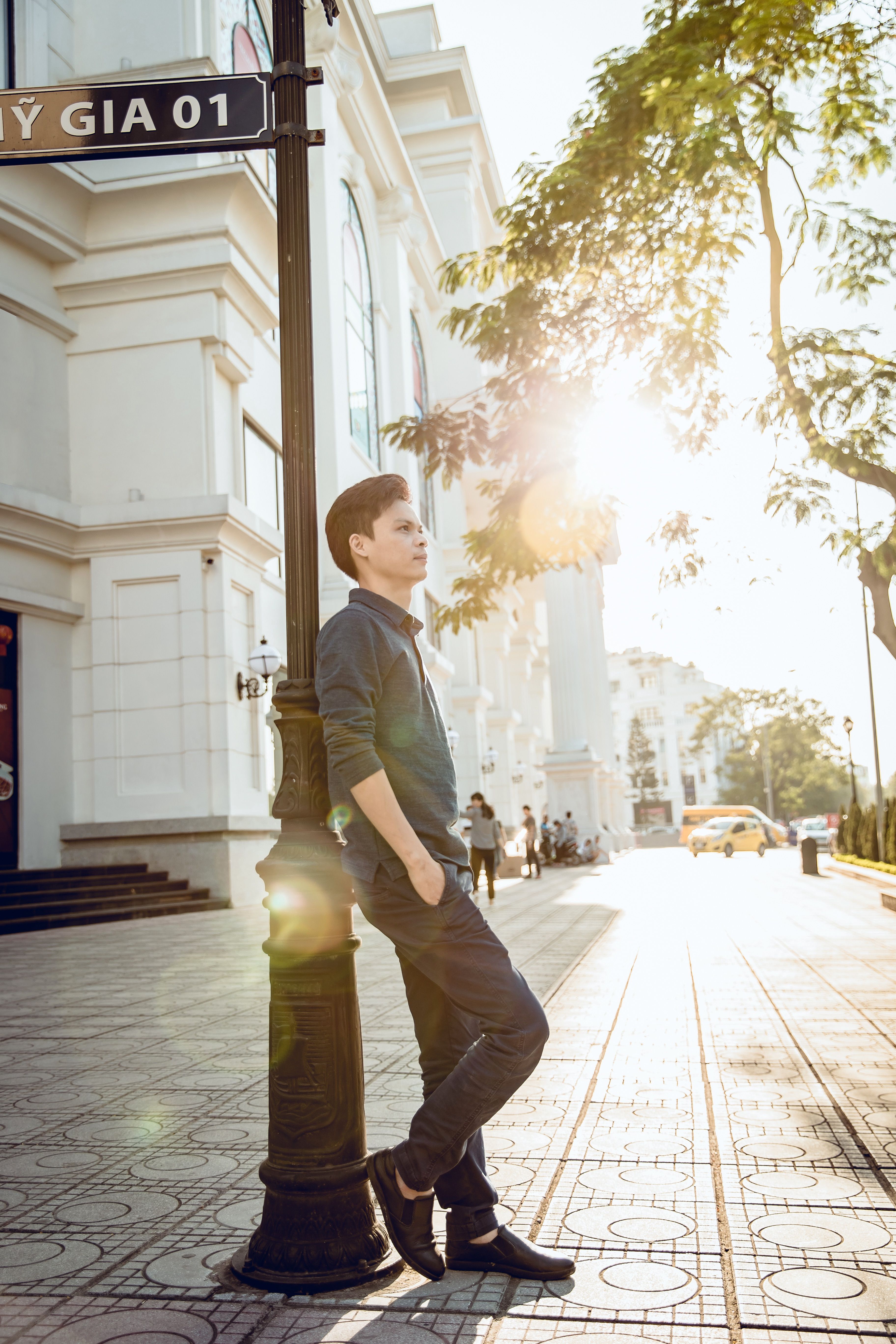 Man Leaning on a Post · Free Stock Photo
